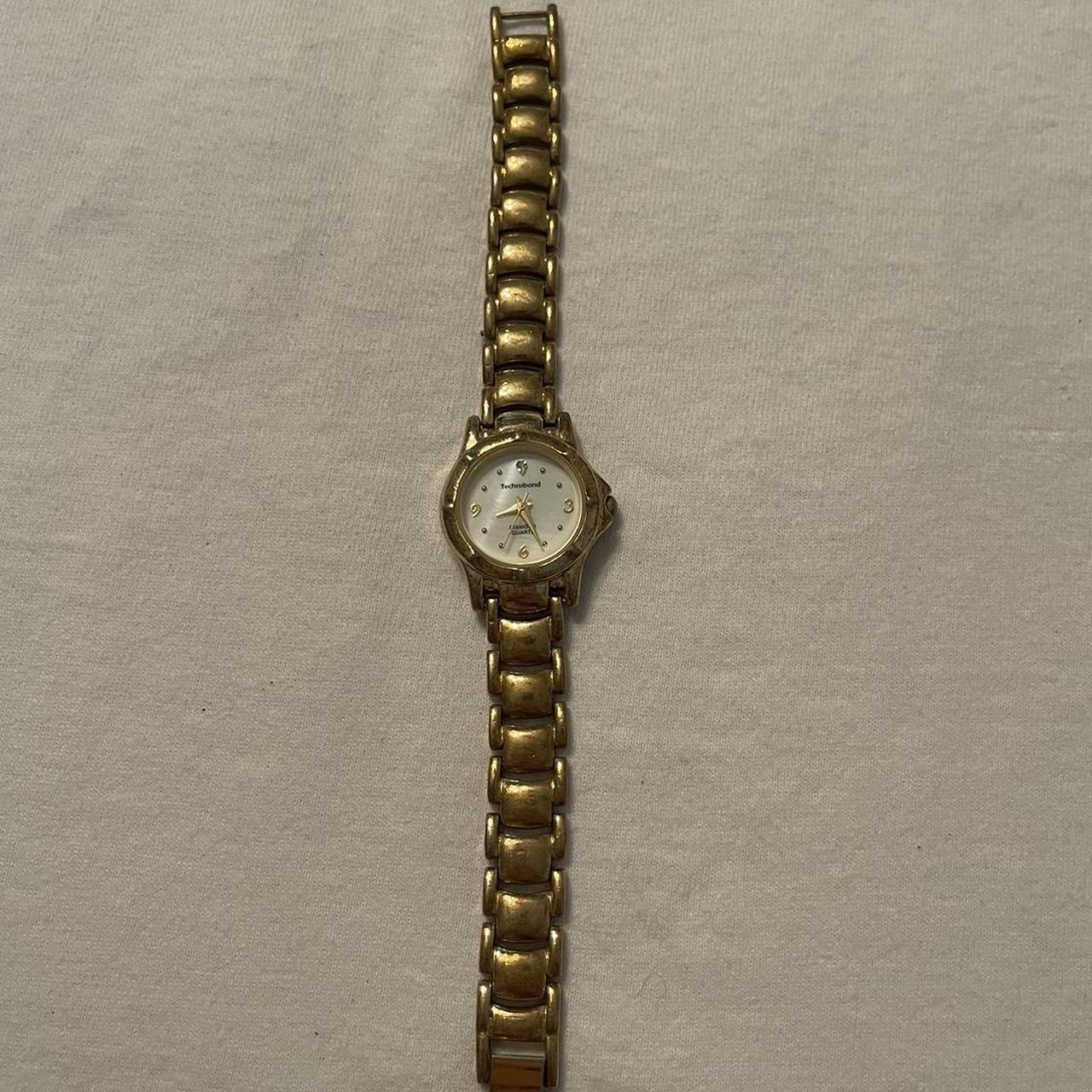 Technibond watch, gold with a pearl face - Depop