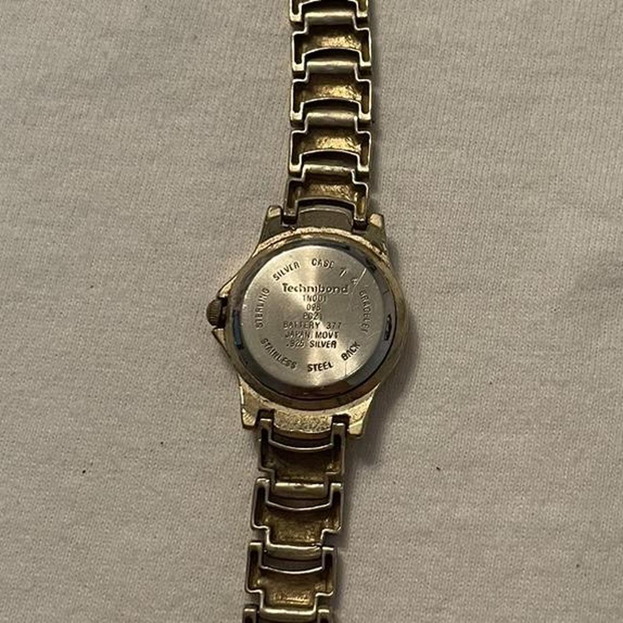 Technibond watch, gold with a pearl face - Depop