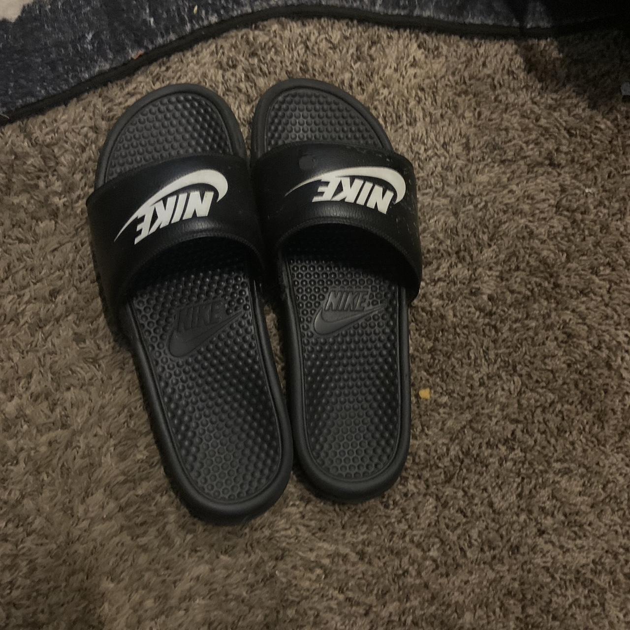 Nike slippers has a lot of like worn multiple... - Depop