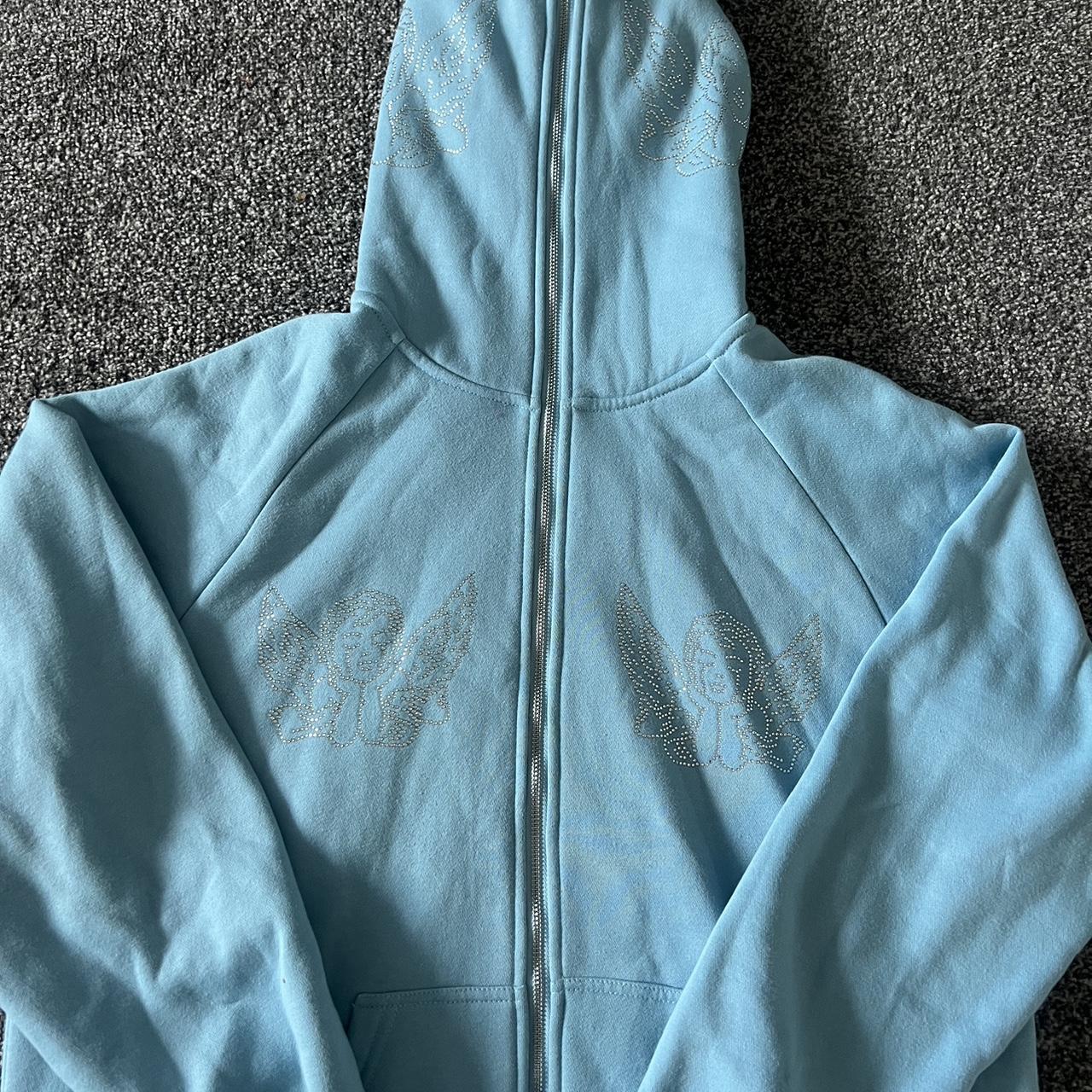 Studed angel baby blue hoodie Worn a few times but... - Depop