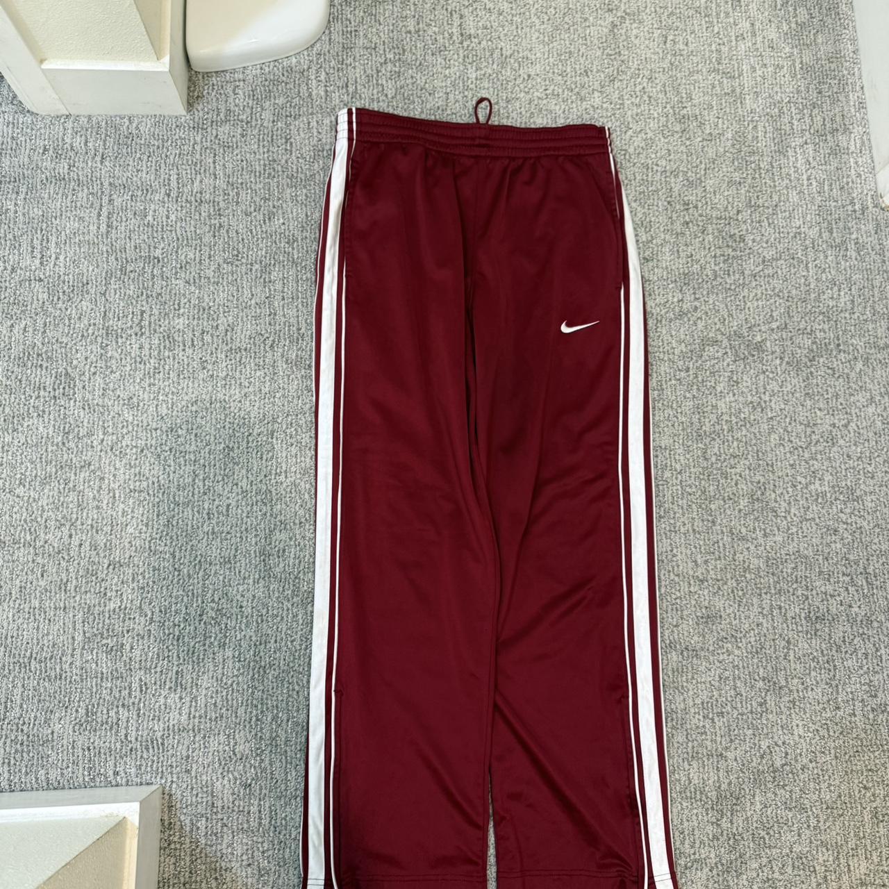 Burgundy/red and white Nike basketball track pants... | Depop