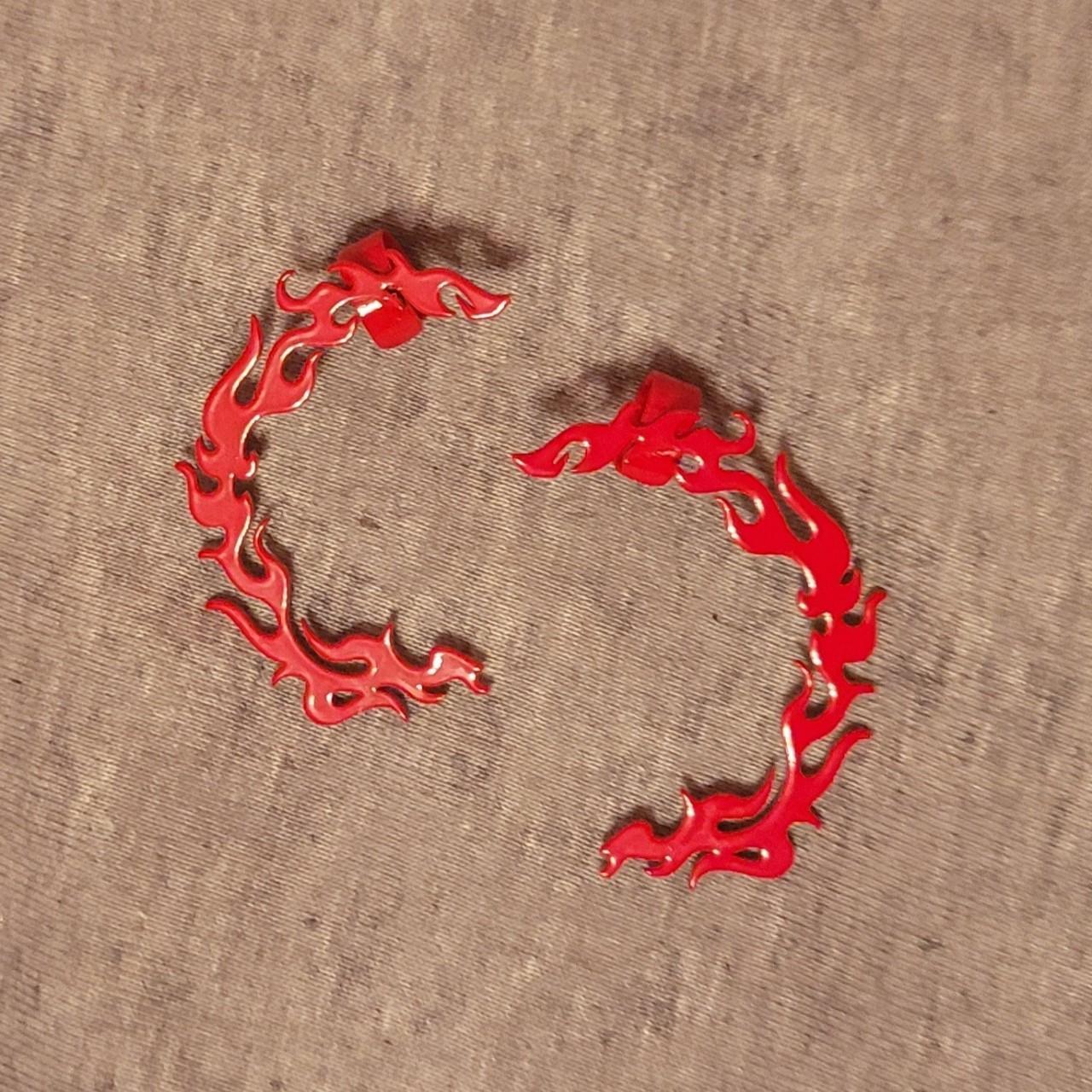 Spirit Halloween red flame ear cuffs Never... - Depop