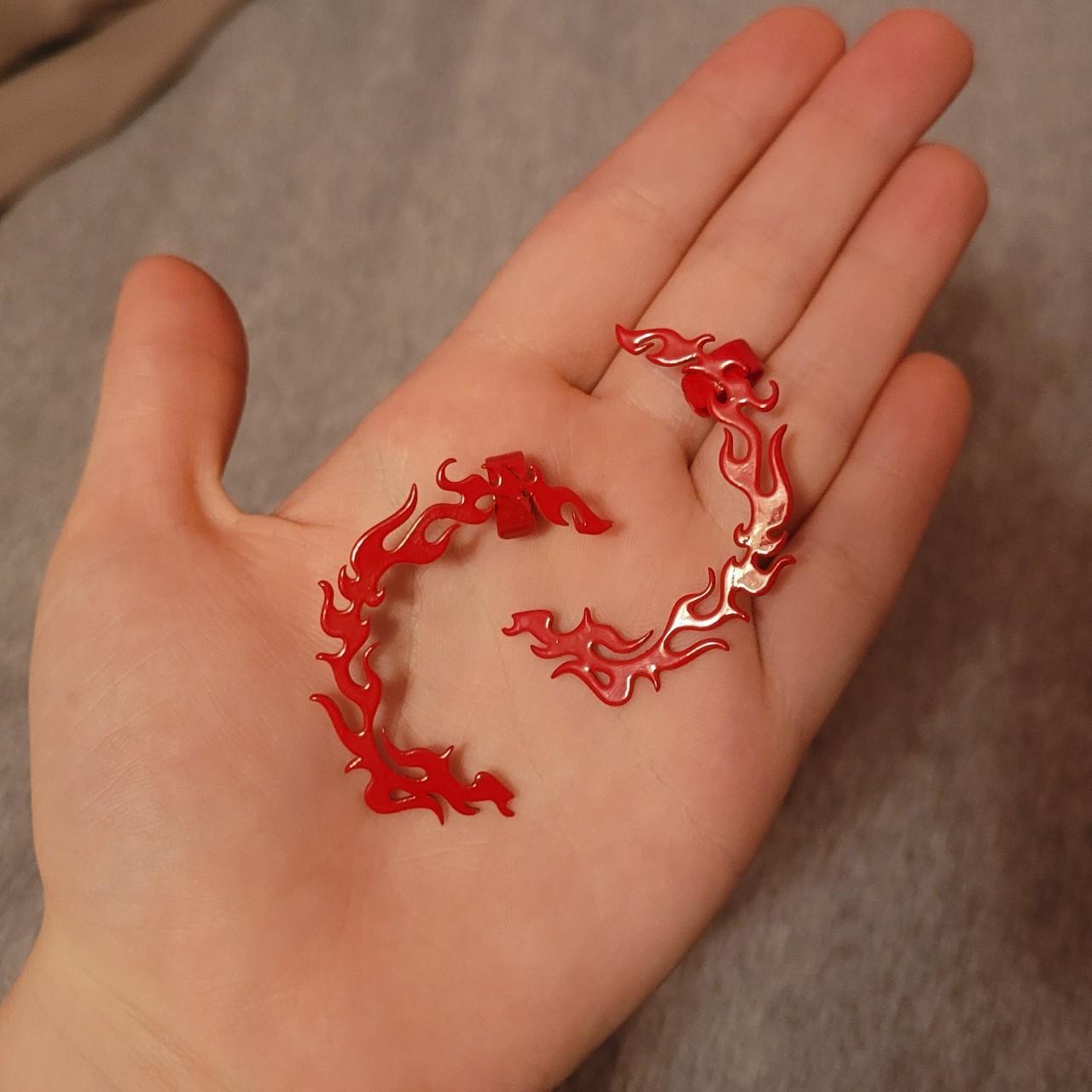Spirit Halloween red flame ear cuffs Never... - Depop