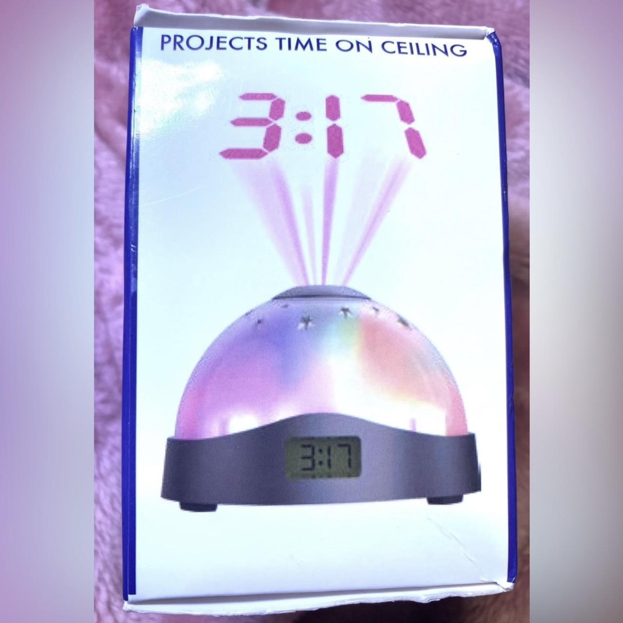 Pink and purple projector clock with 3:17 time setting - Depop
