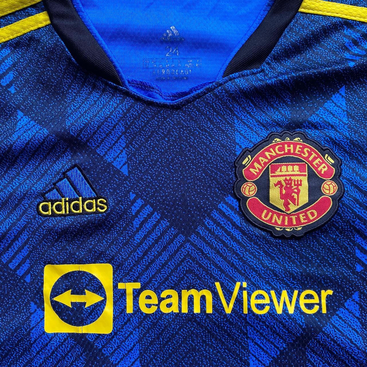 manchester united blue soccer jersey modeled on... - Depop