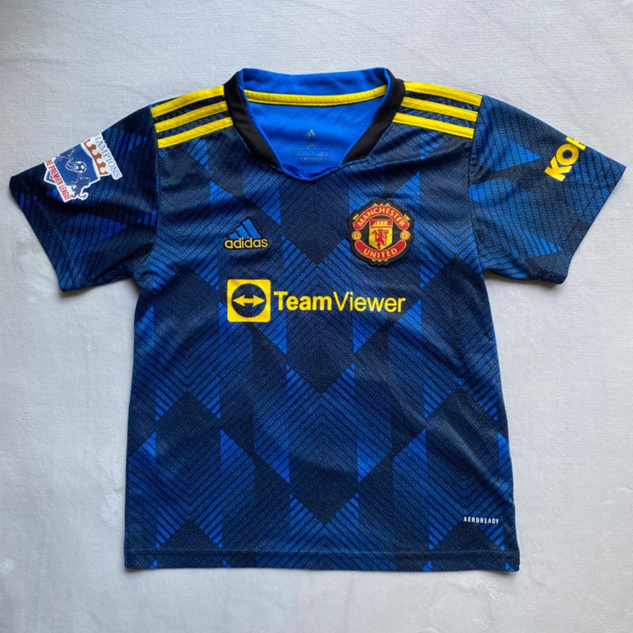 manchester united blue soccer jersey modeled on... - Depop