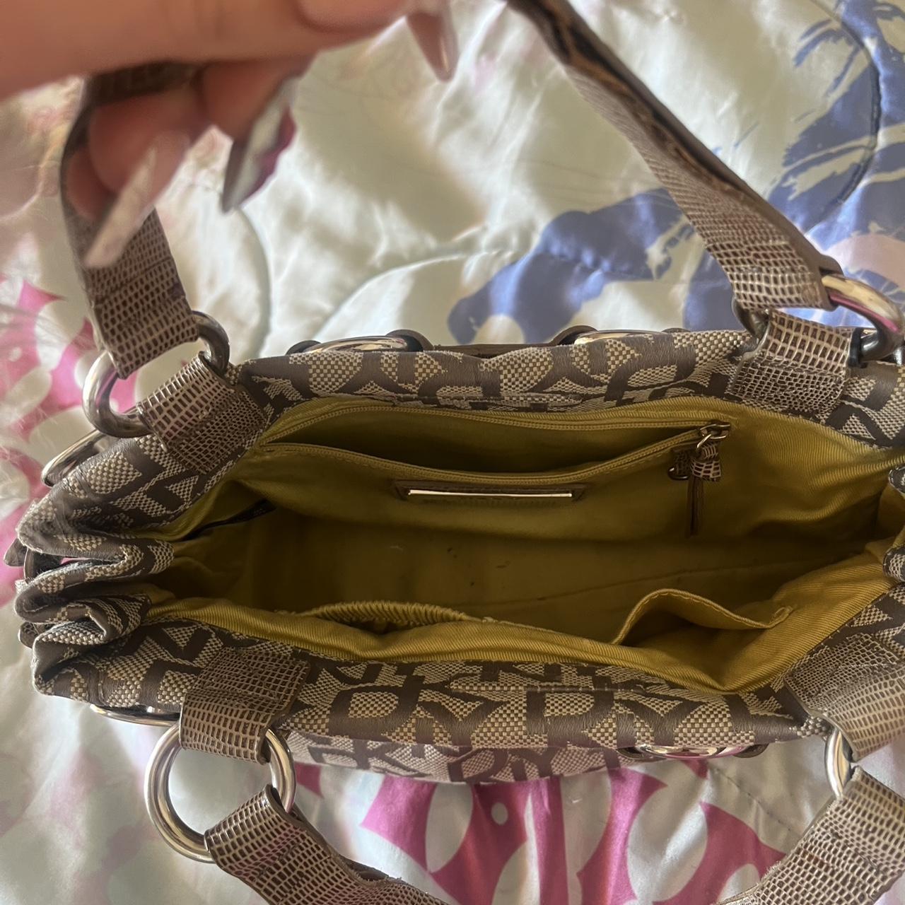 Brown and tan DKNY bag with yellow interior straps... | Depop