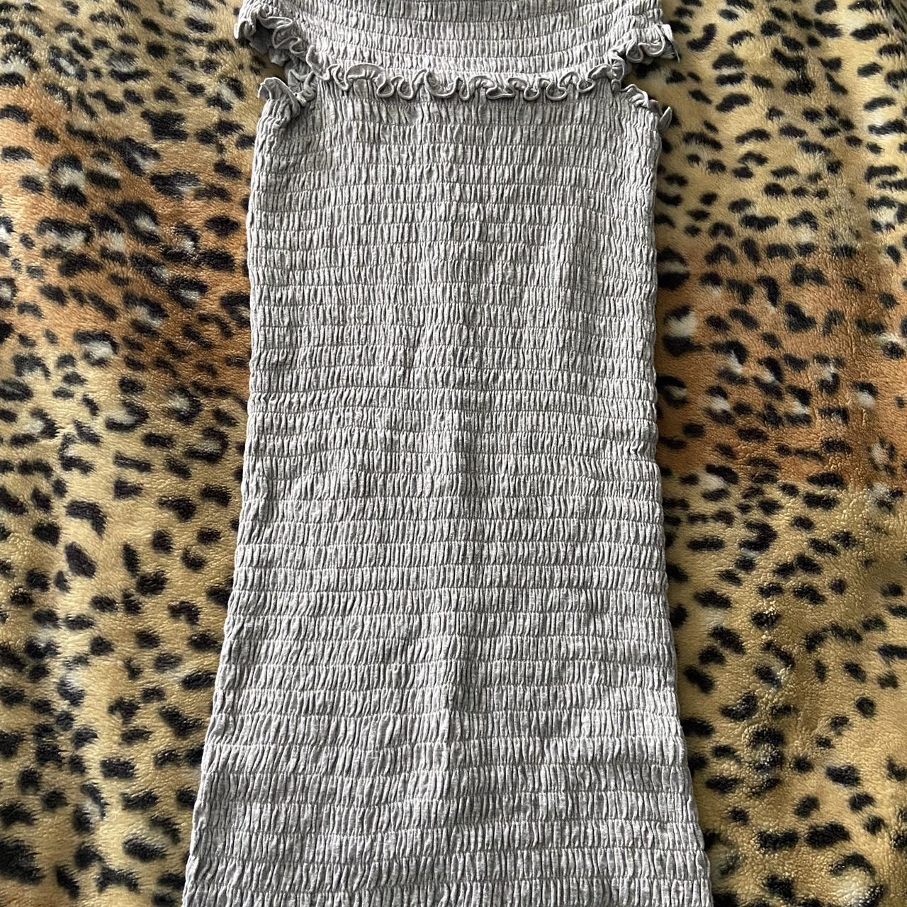 Grey ruffle mini dress. Super stretchy and molds to... - Depop