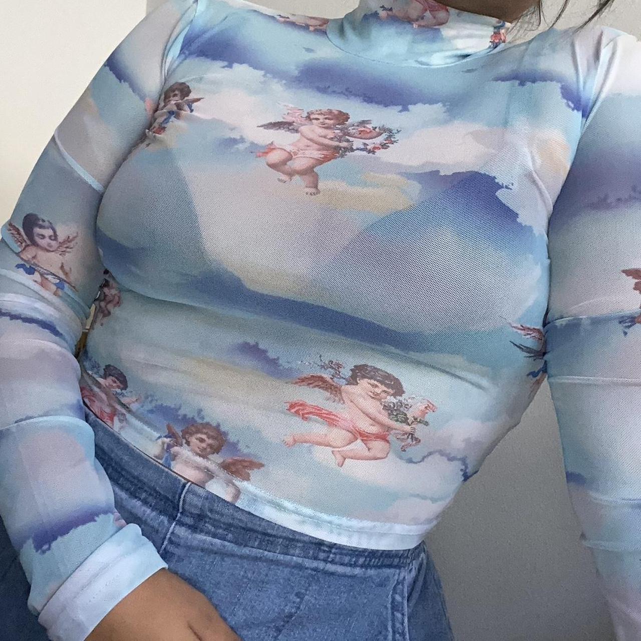 Soft cherub/angel turtleneck mesh crop top LG... - Depop