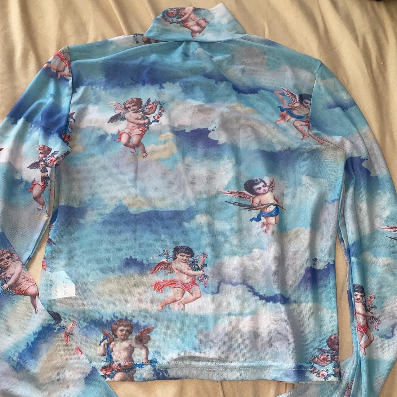 Soft cherub/angel turtleneck mesh crop top LG... - Depop
