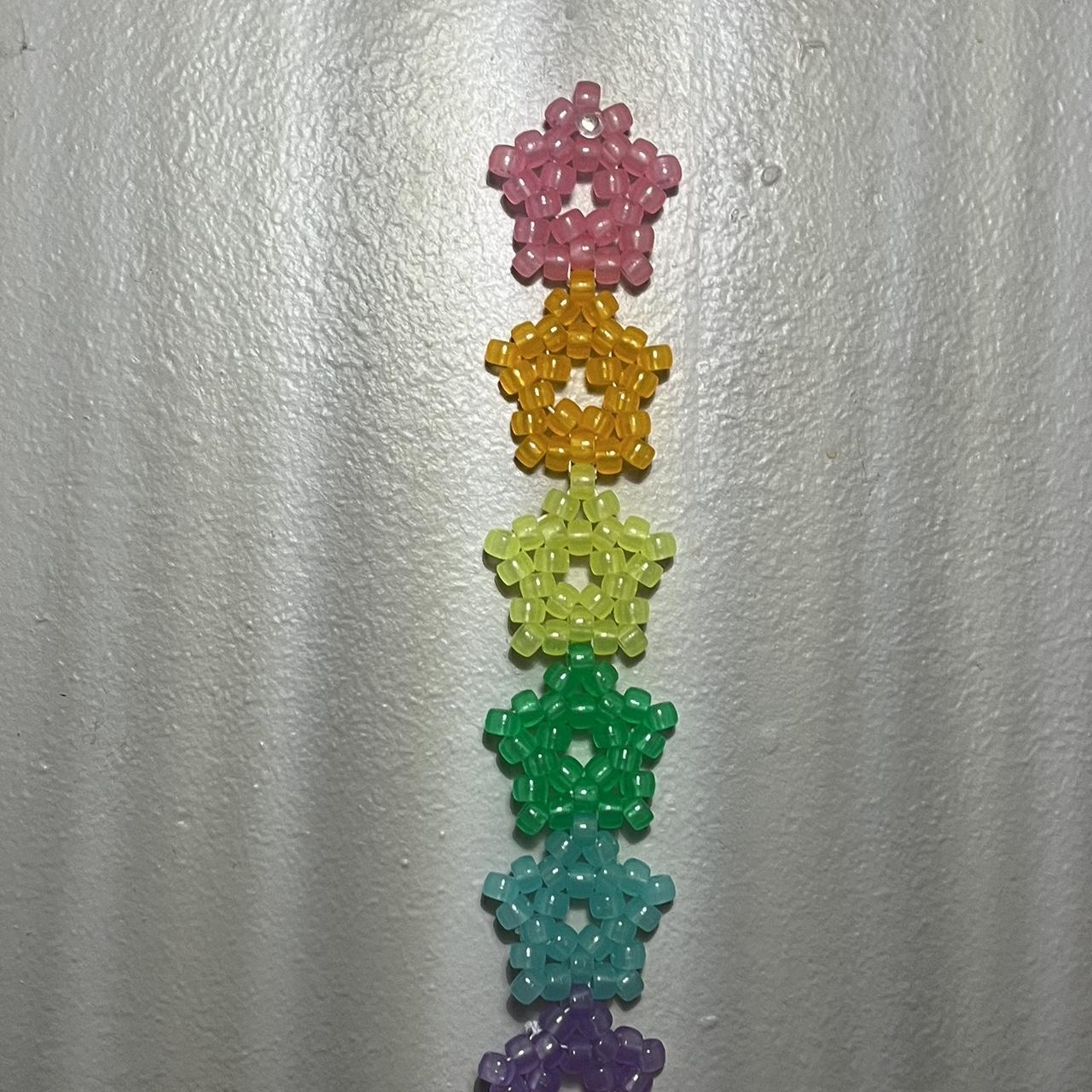 glow in the dark rainbow star kandi wall hanging,... - Depop