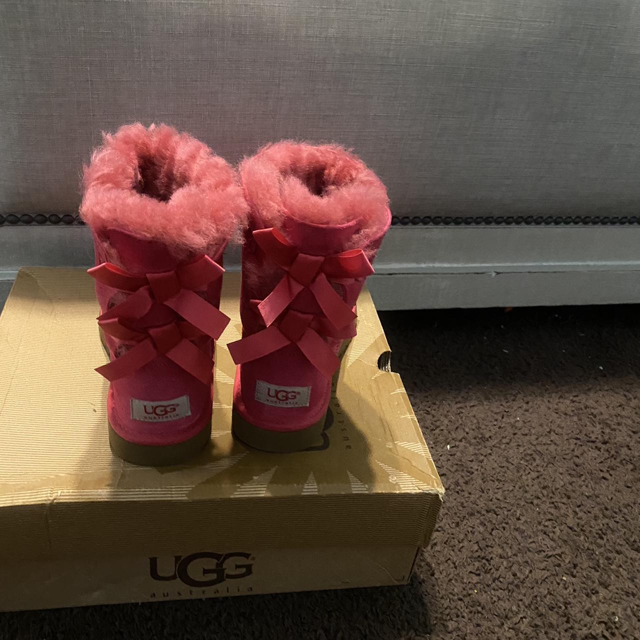 Pink UGG boots with bows.They are a size 2 in kids.... - Depop
