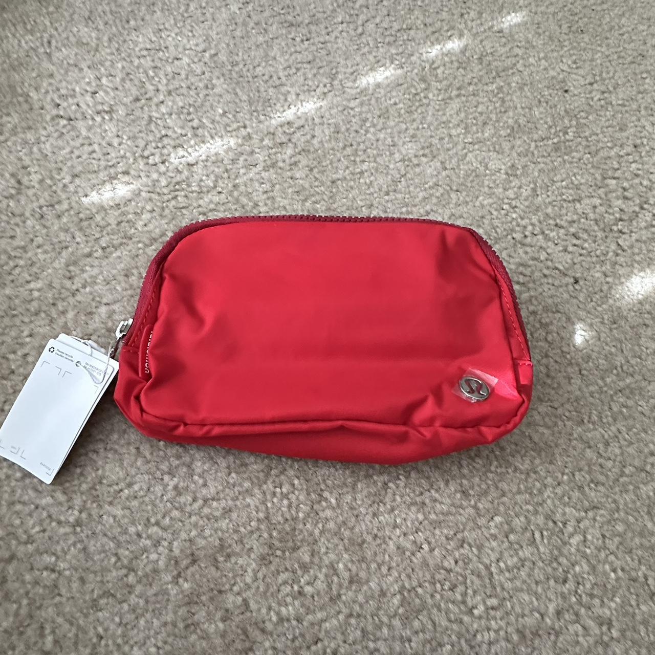 Lululemon red cosmetic bag with zipper closure and... - Depop