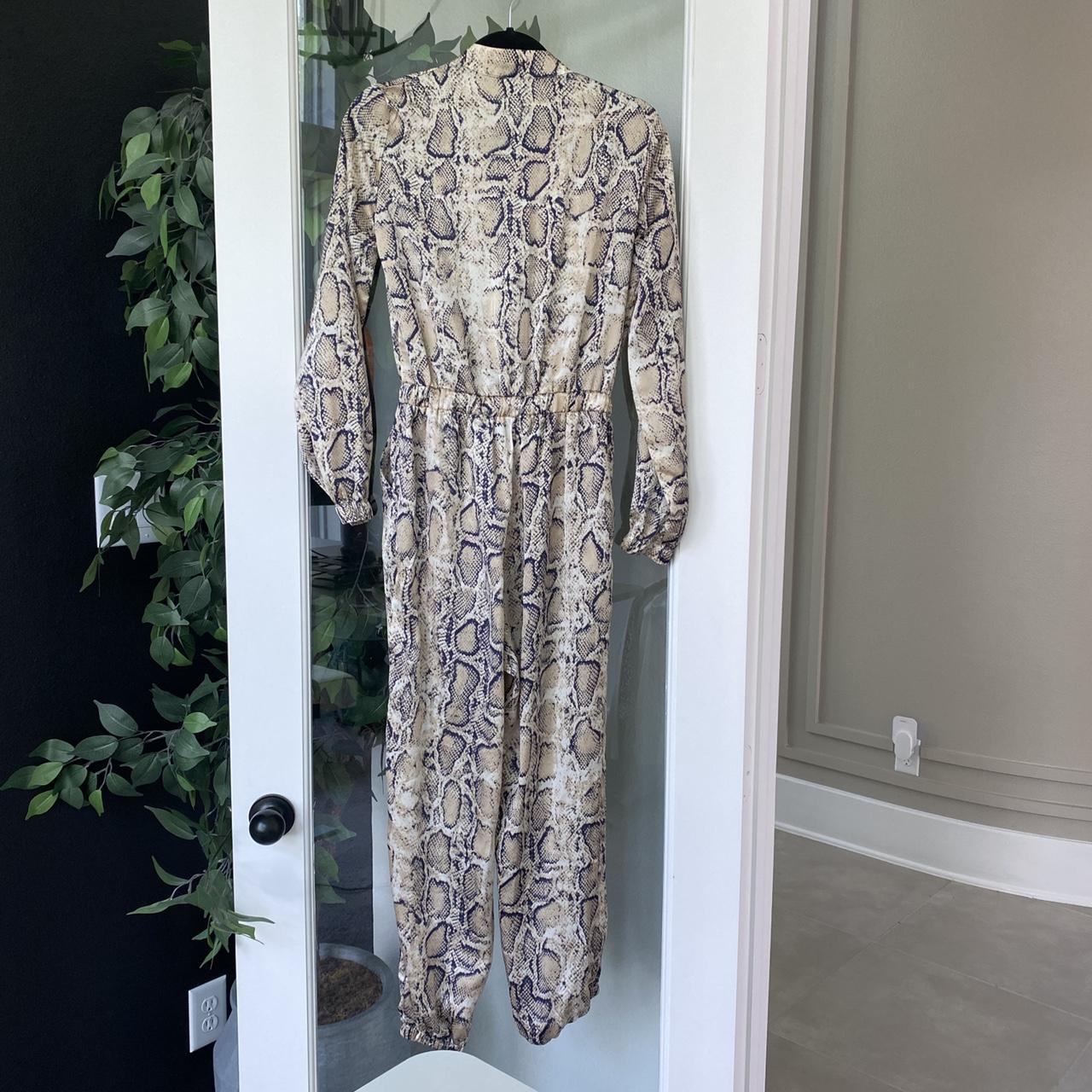 Fashion Nova snake print jumpsuit with drawstring... - Depop