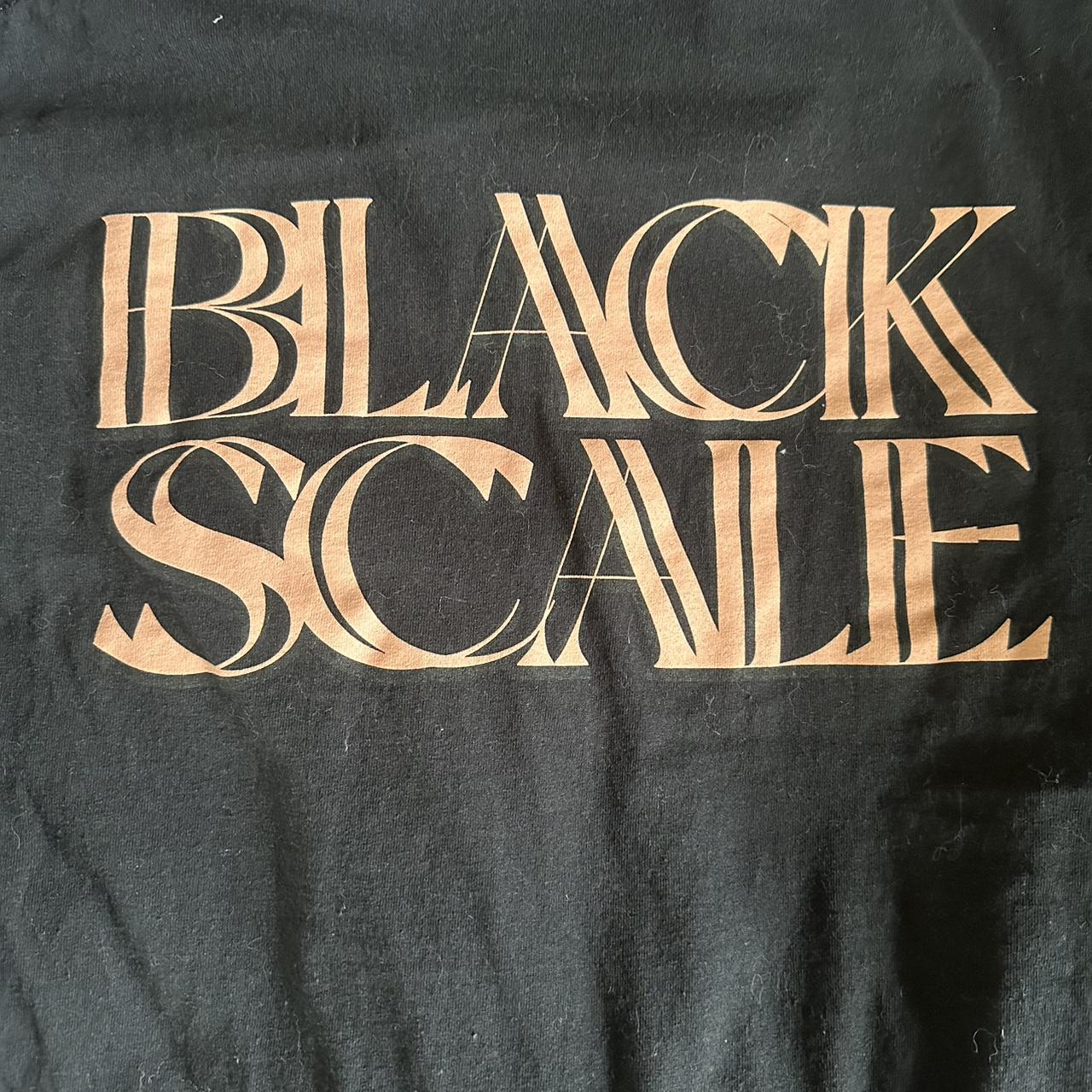 Black scale brand black and gold size l Lightly... - Depop