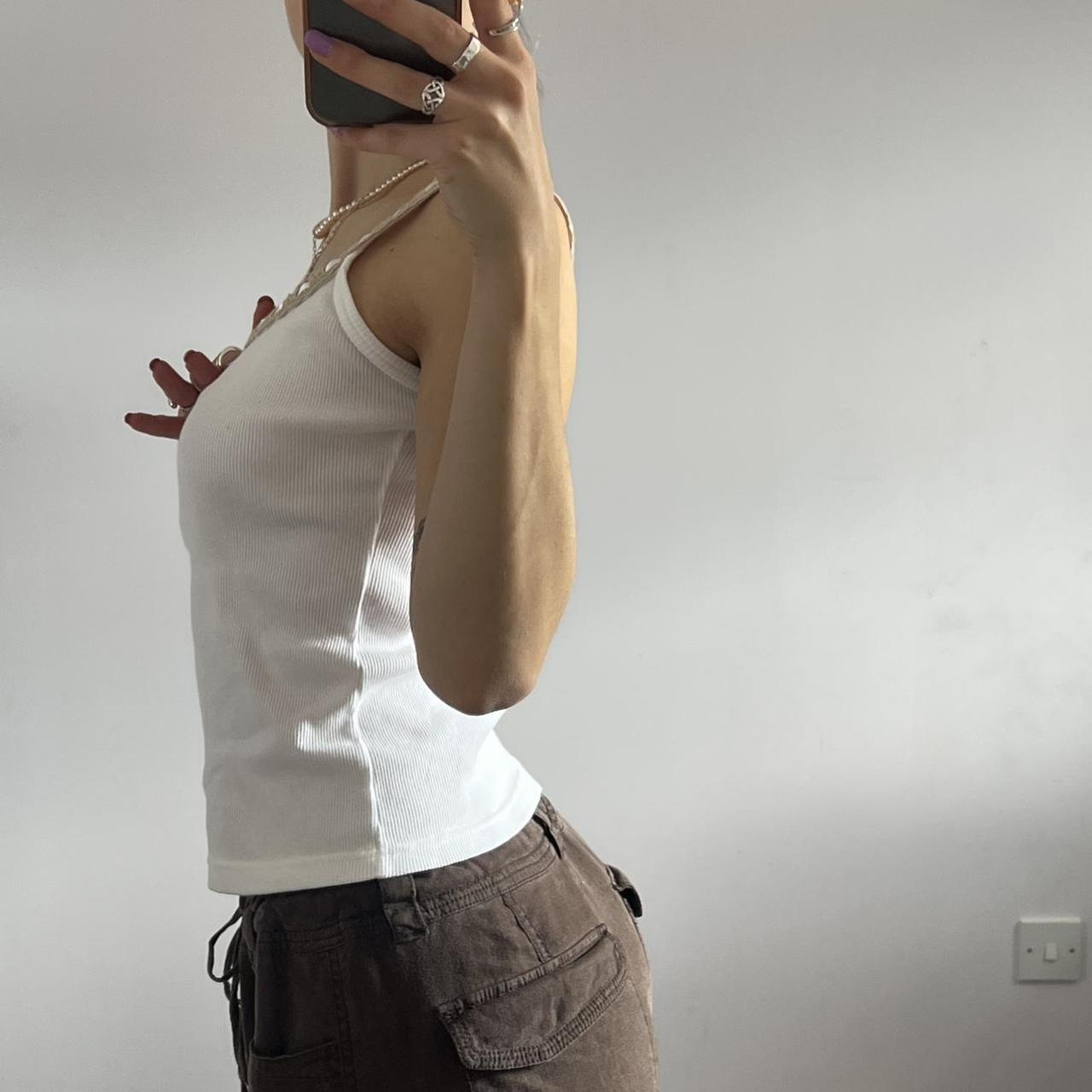 White ribbed vest with lace trim and mini bow, size... - Depop