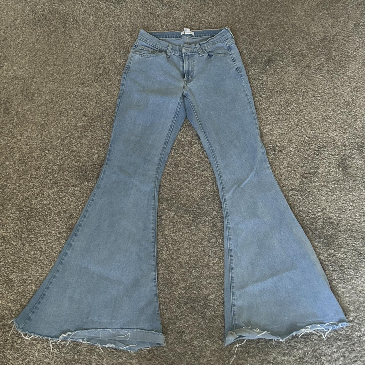women’s low rise light blue flared jeans - Depop