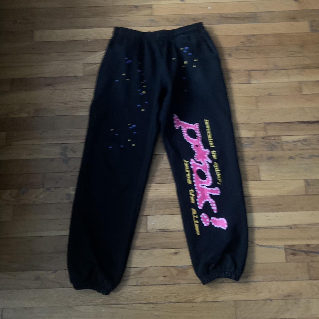 Black and pink Spider Worldwide sweatpants | Depop