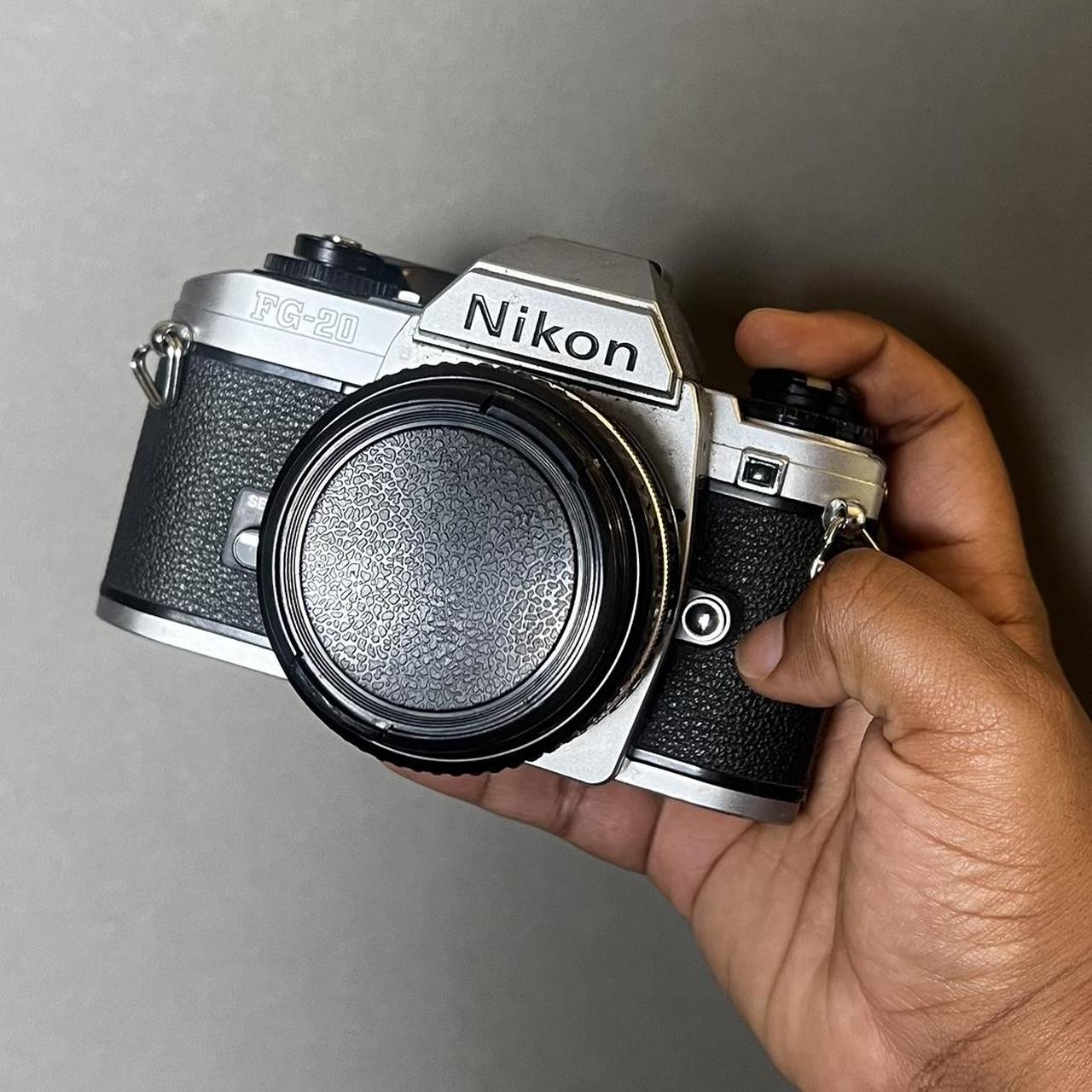 Nikon FG-20 SLR film camera with a beautiful silver... | Depop