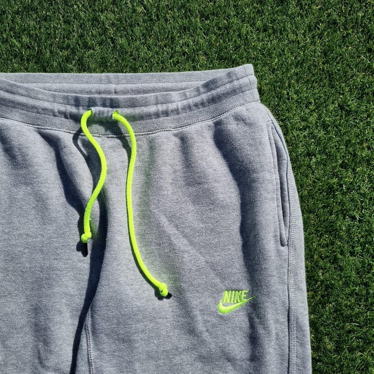 sick grey and fluro nike sweatpants, size XL womens.... | Depop