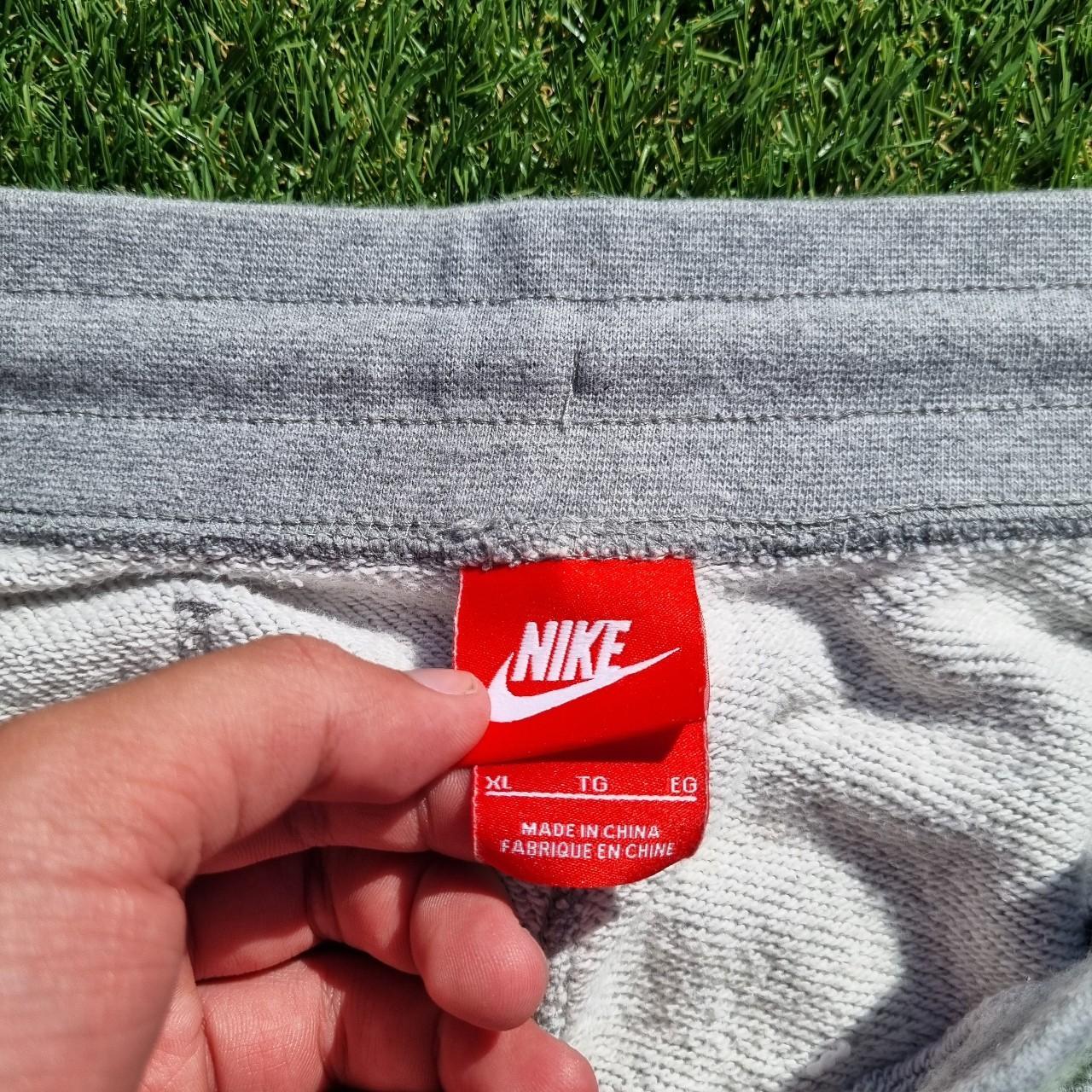 sick grey and fluro nike sweatpants, size XL womens.... | Depop