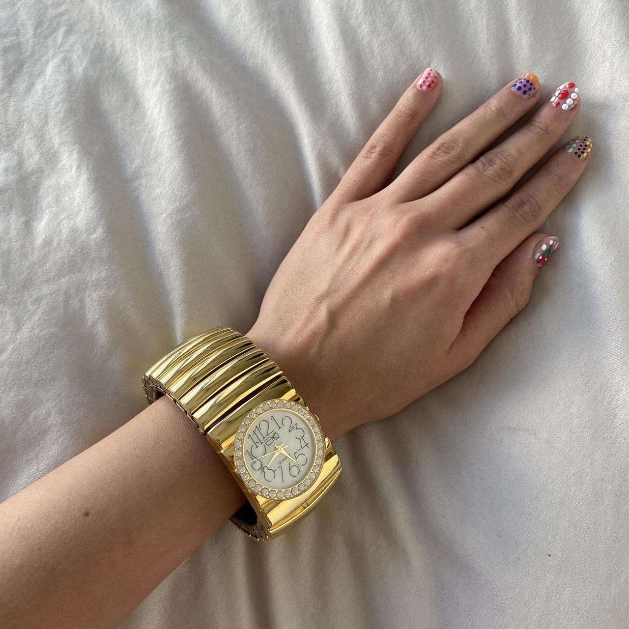 Chunky gold watch Idk if it works or if it just... - Depop