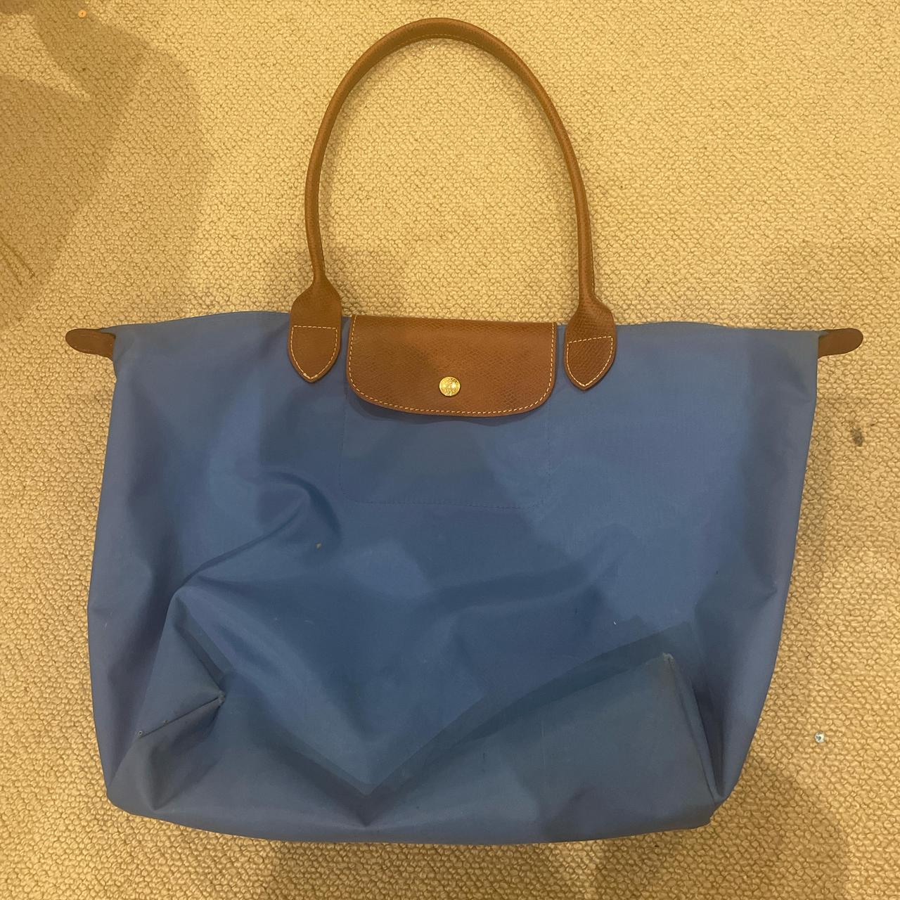 real longchamp blue handbag has two small holes bit... - Depop