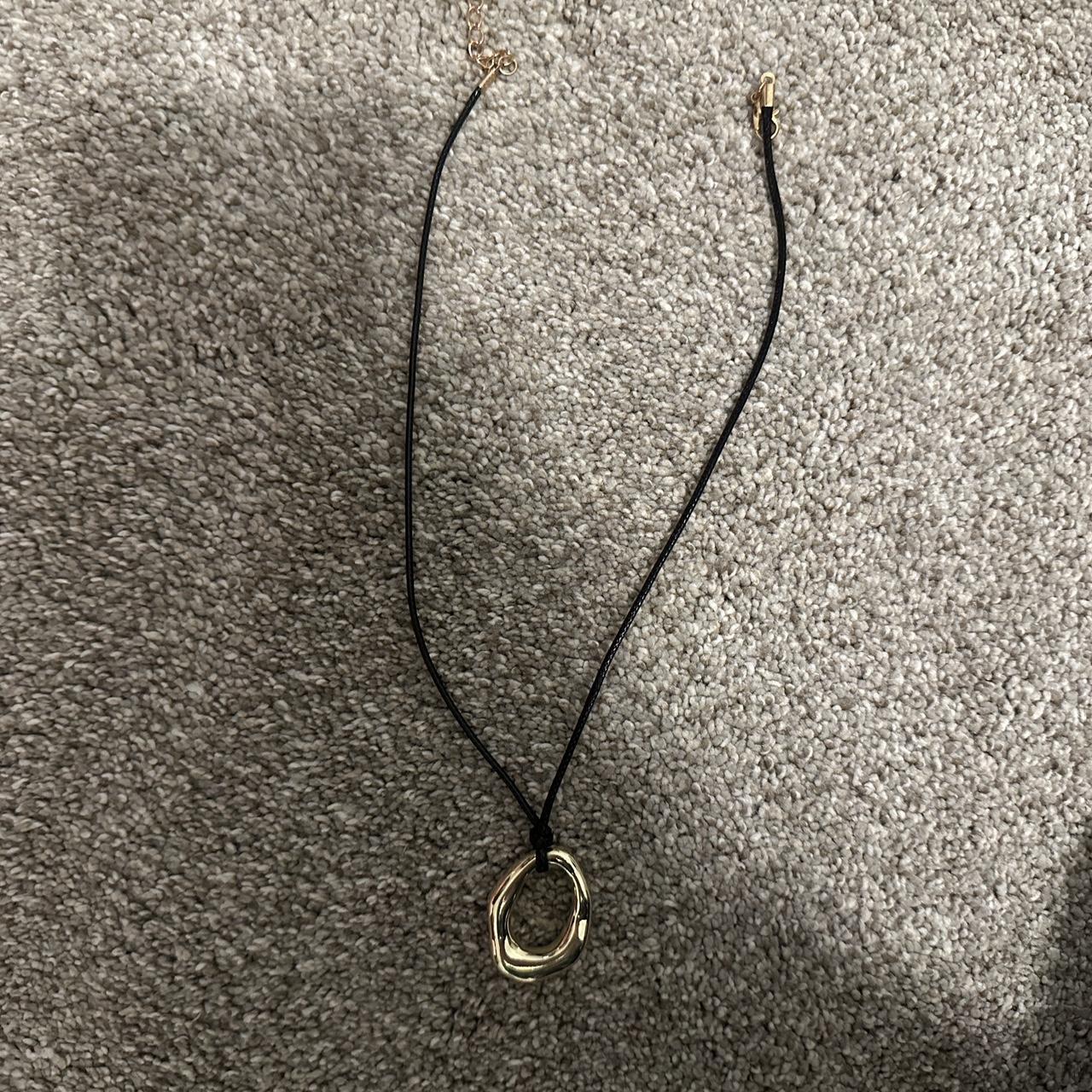 Edikted Gold tone necklace with black cord... - Depop