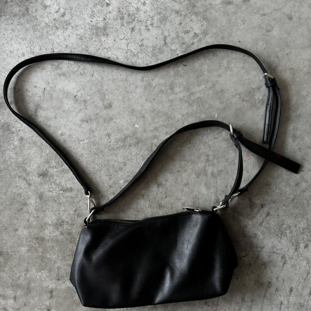 Black leather crossbody bag with silver hardware... - Depop