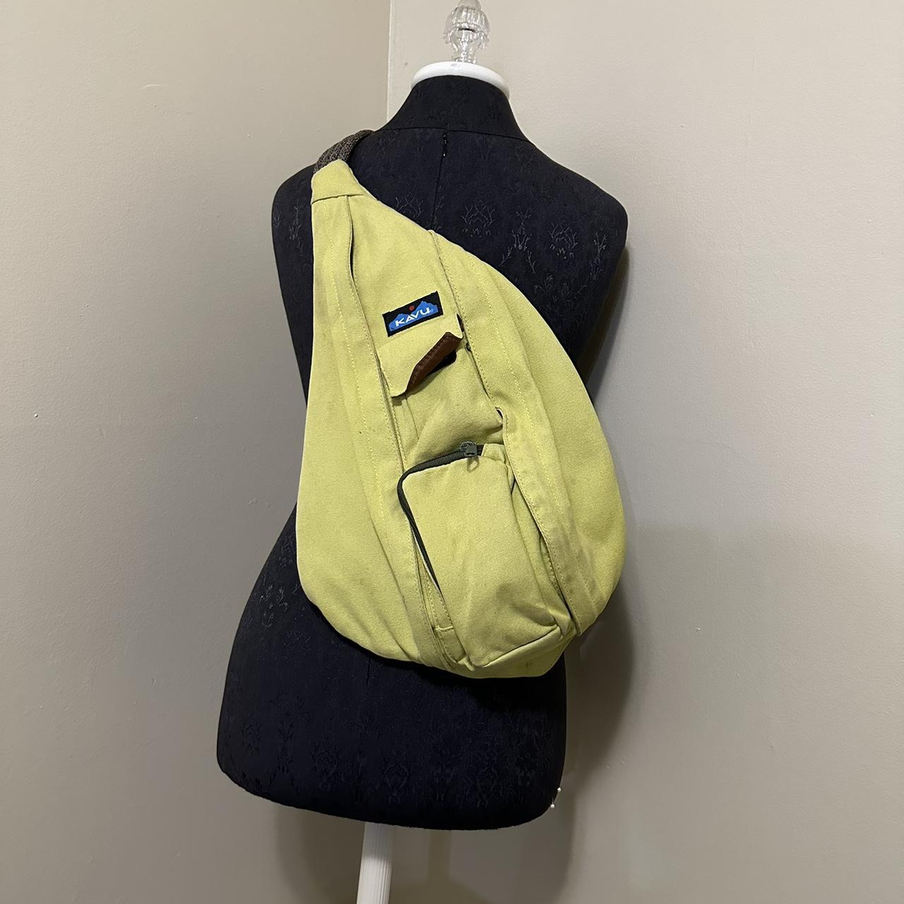 Kavu green sling backpack with a front pocket and... - Depop