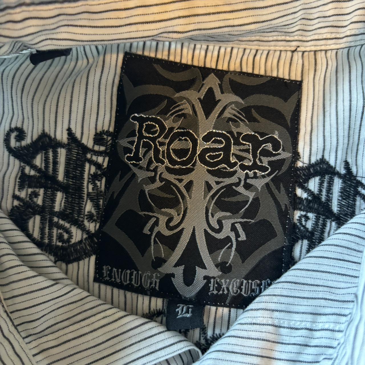 Roar White and black striped button up shirt with a... - Depop