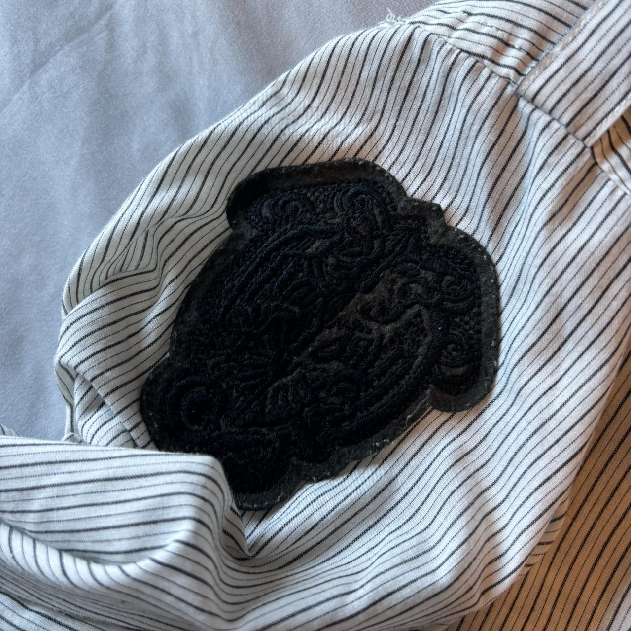 Roar White and black striped button up shirt with a... - Depop