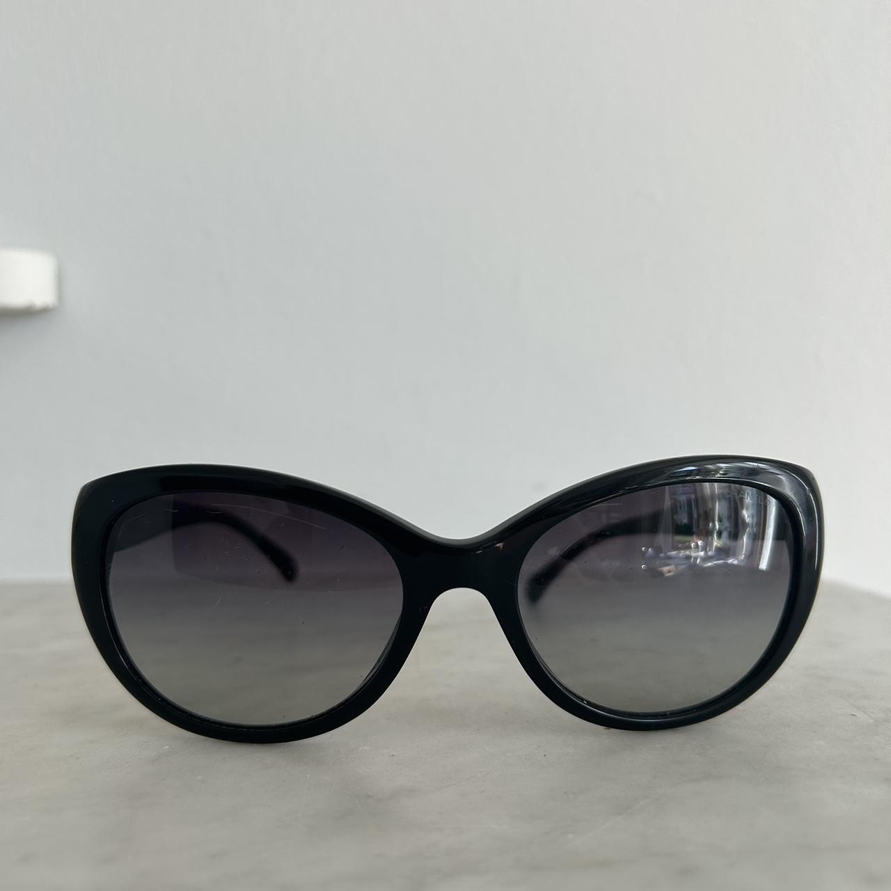 Black Chanel Sunglasses. In a classic oval shape... - Depop