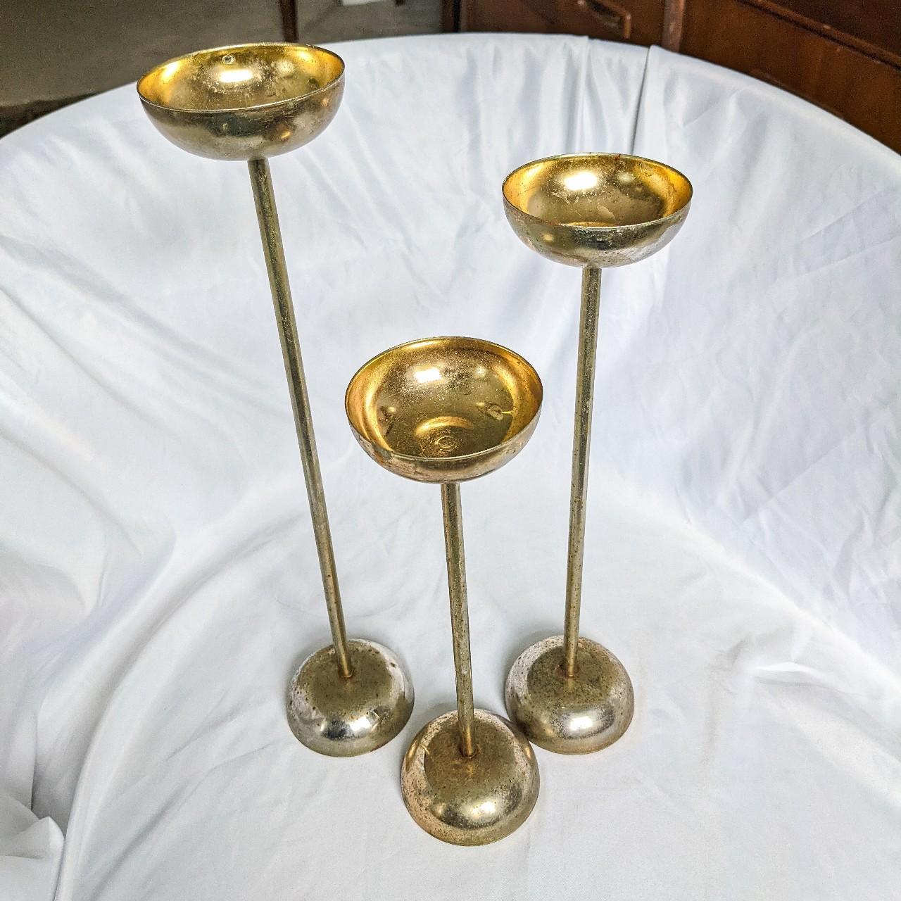 Set of Three Brass Candelabras. A small candle can... - Depop