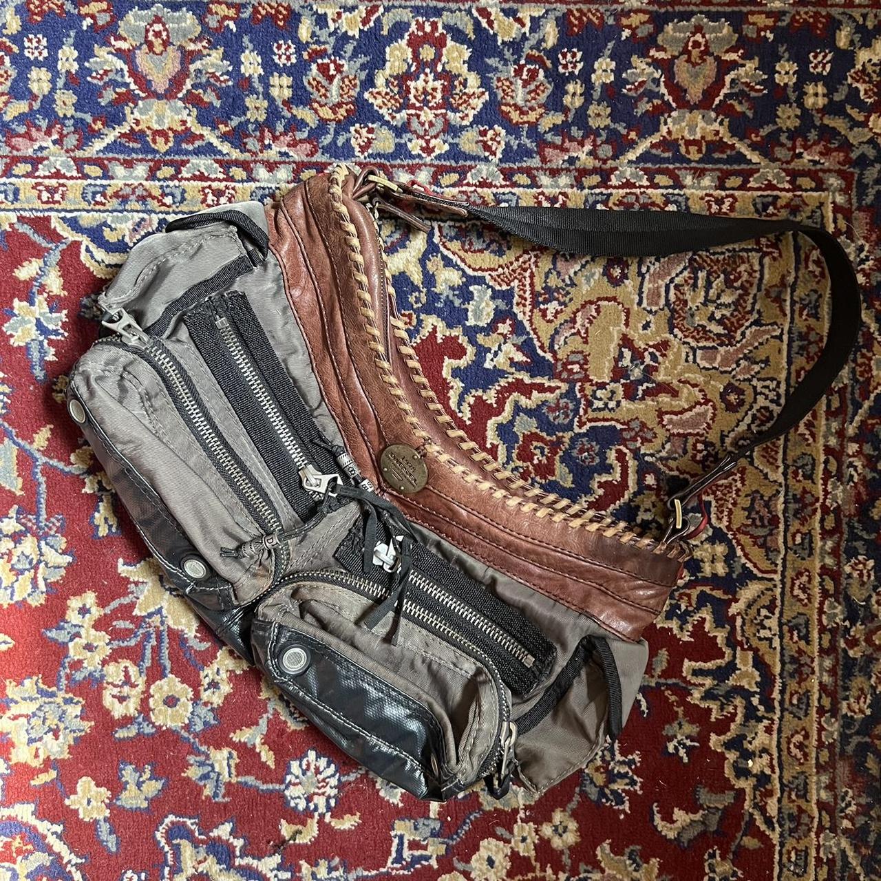 The perfect diesel bag… yet the inside is very worn.... - Depop
