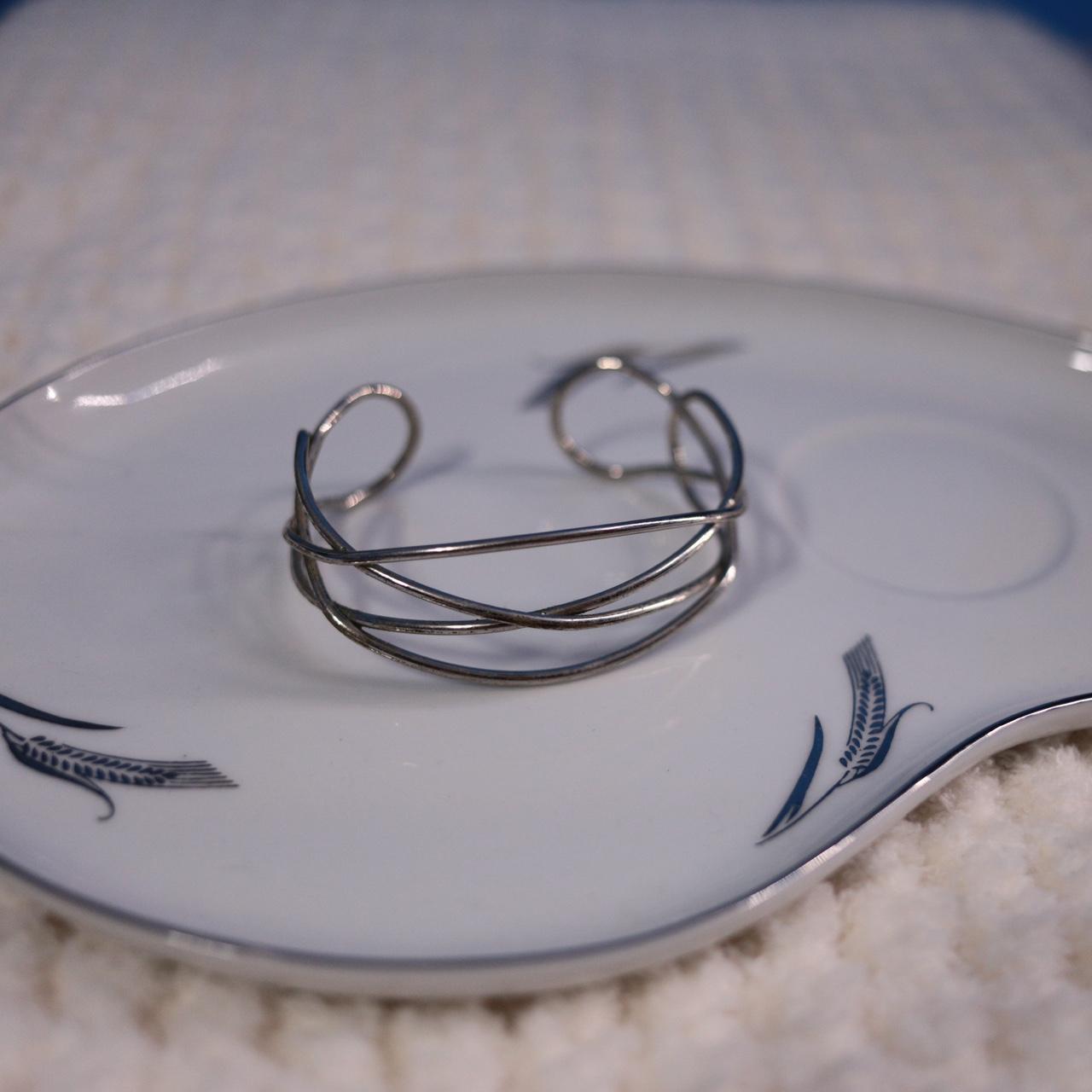 Lia Sophia Jinx Silver Cuff Bracelet; signs of wear... - Depop