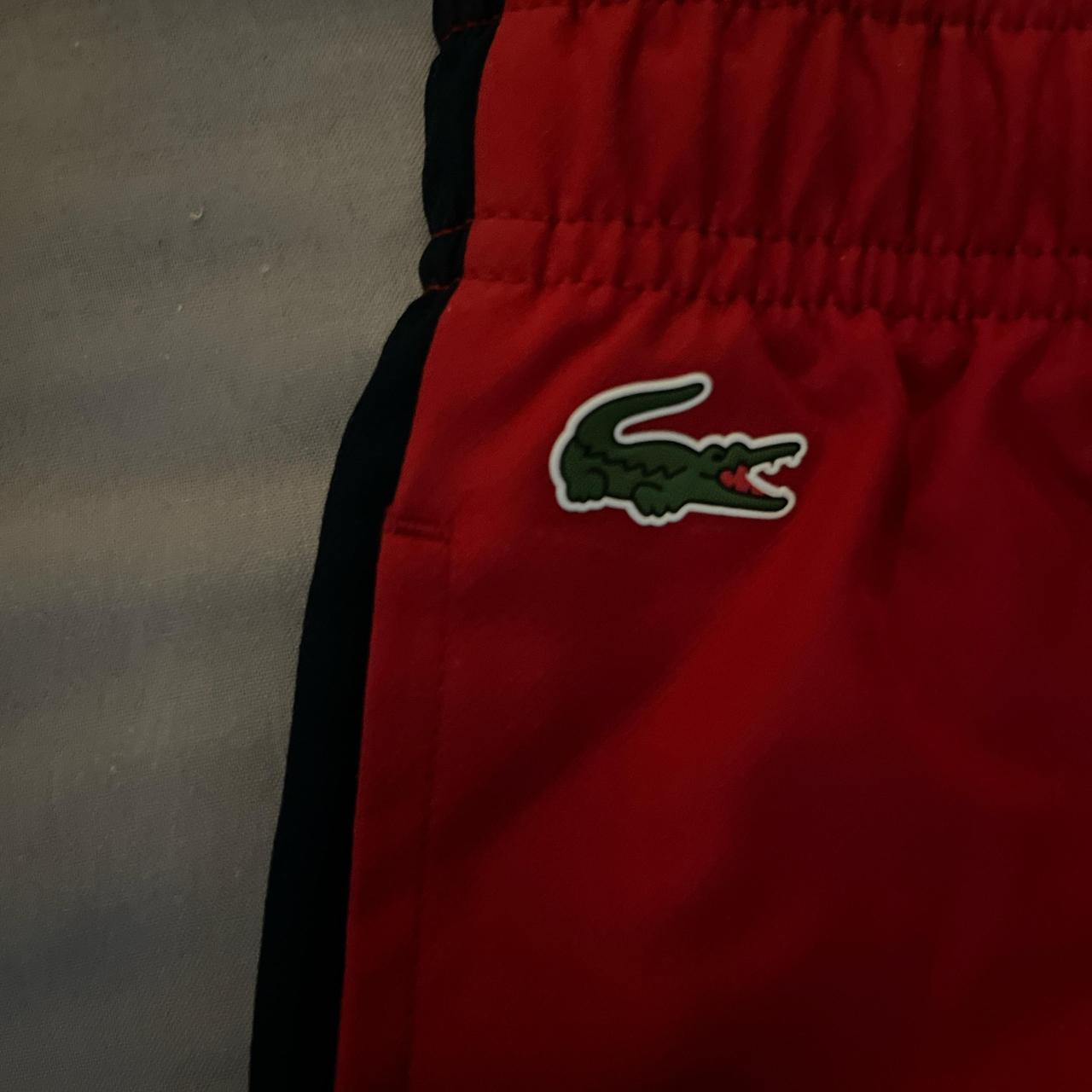 Lacoste red and white tracksuit bottoms (kids s) - Depop