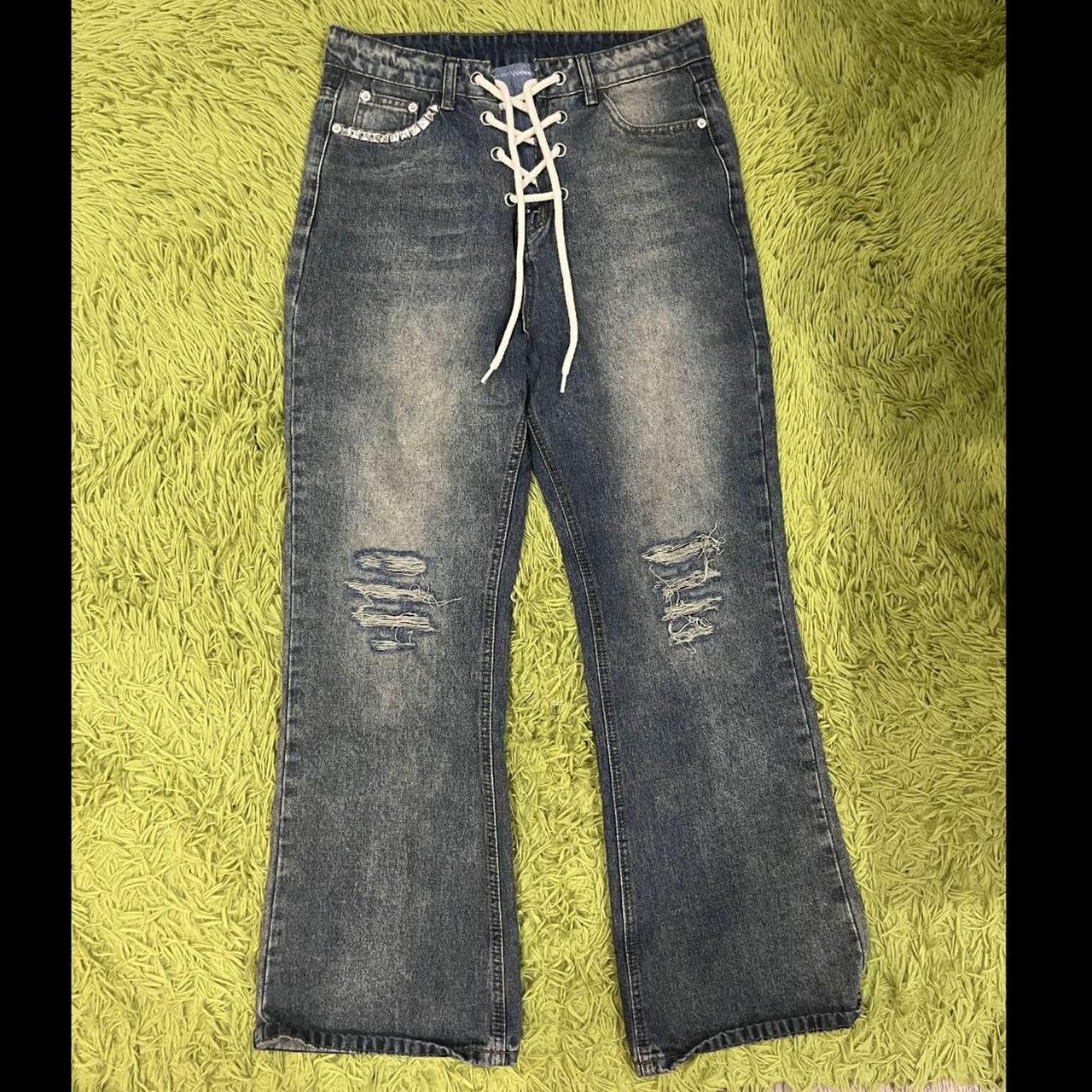 Laced up washed flared jeans with studs and... - Depop