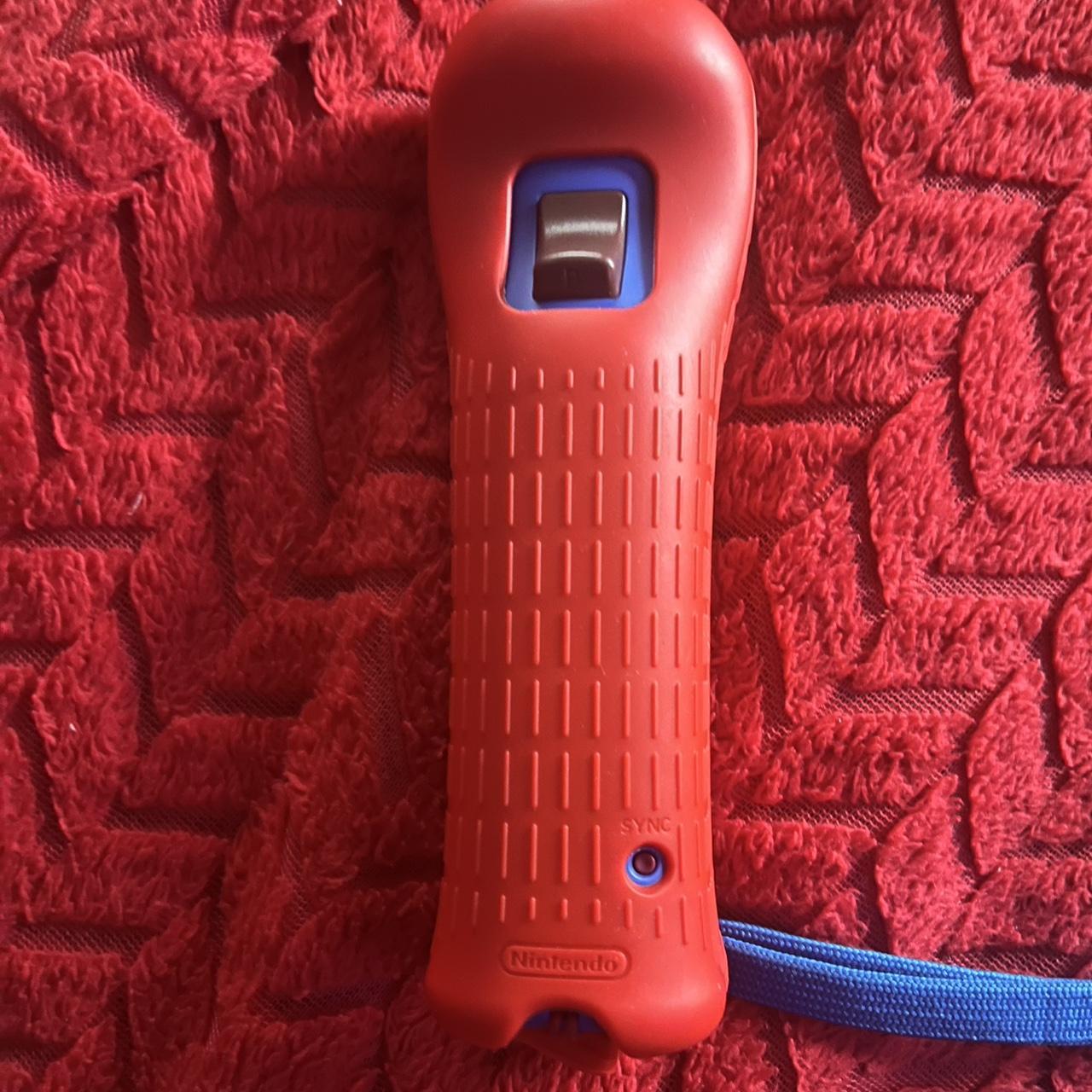 Red Wii MotionPlus controller with blue strap #Wii... | Depop