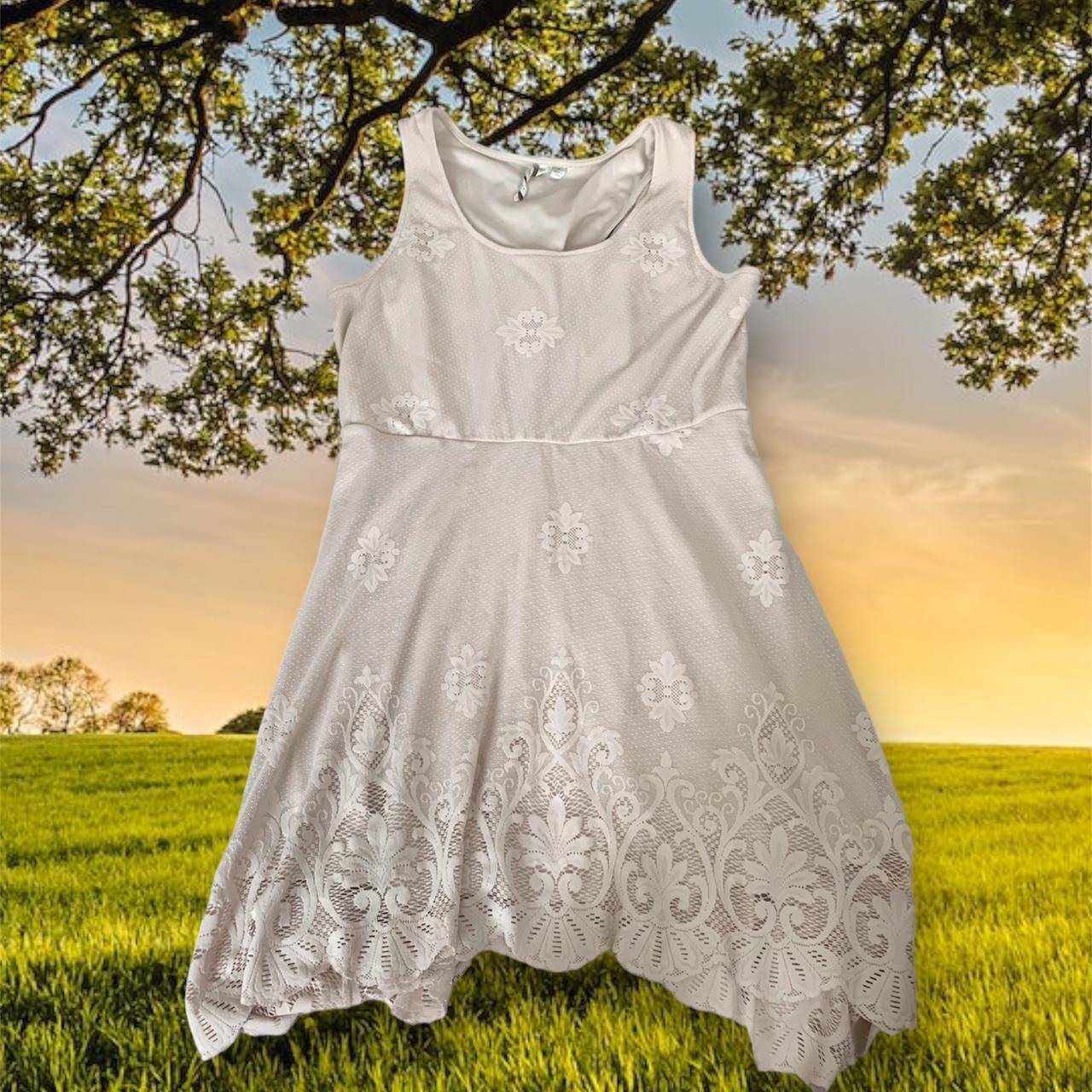 Cream colored sundress with back cutout - Depop