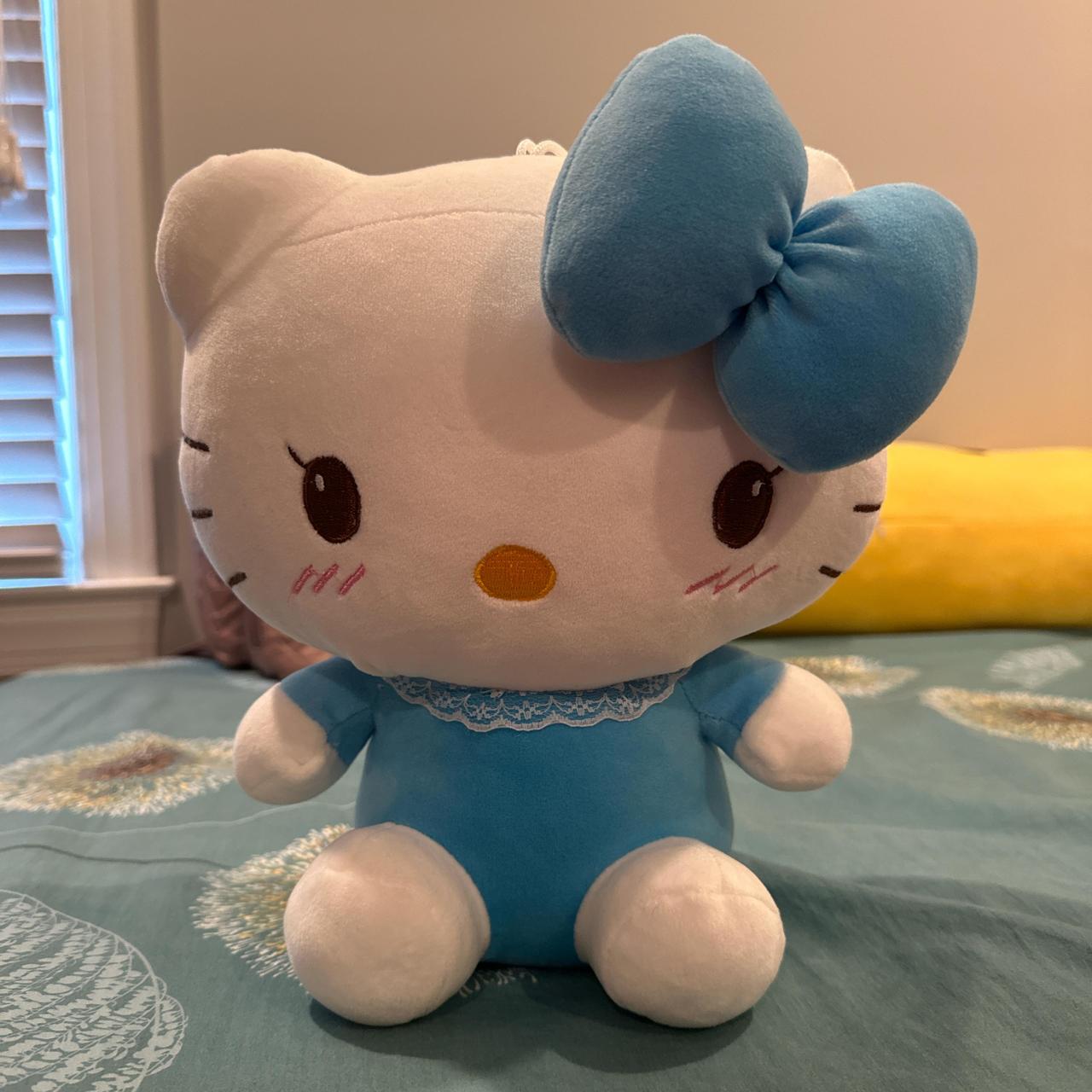 Adorable Hello Kitty plushie with a blue bow on her... - Depop