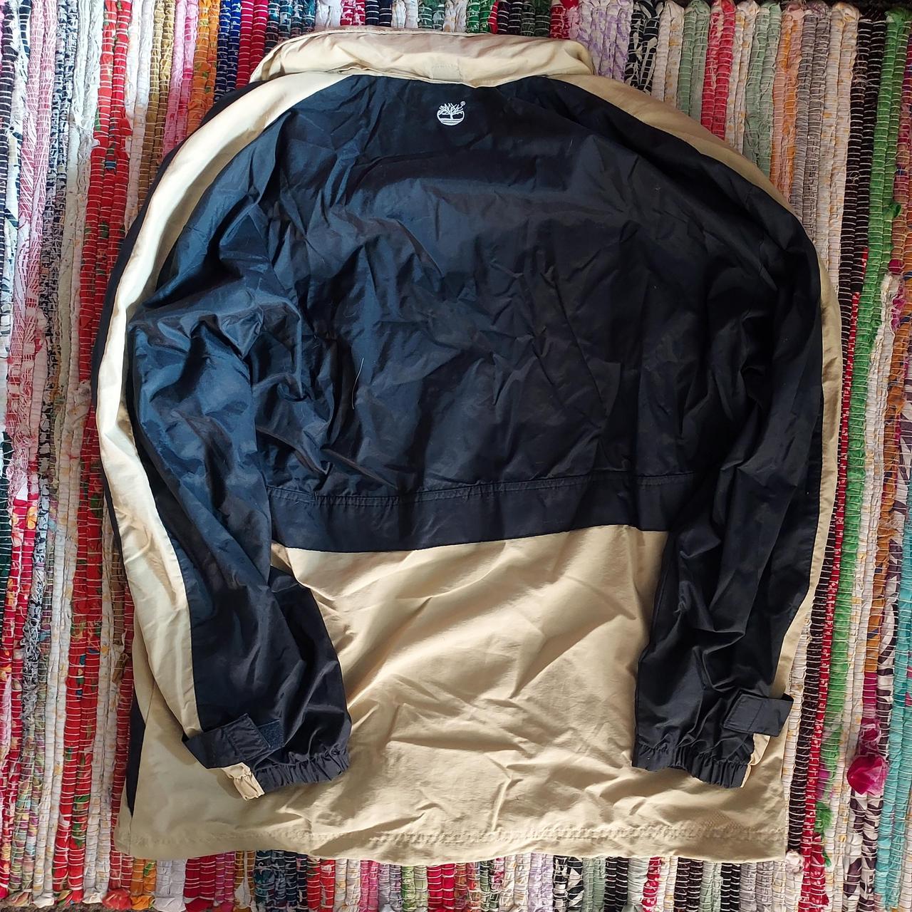 Large Timberland performance jacket. Black and beige... - Depop