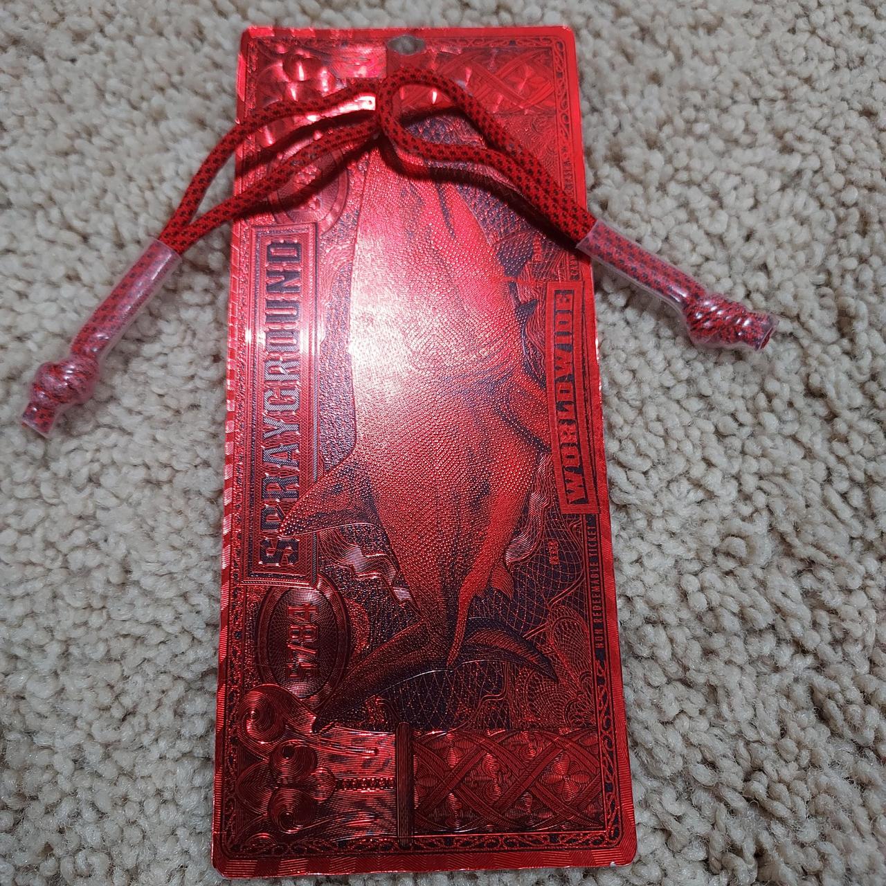 2 red nike elite tags with a sprayground tag - Depop