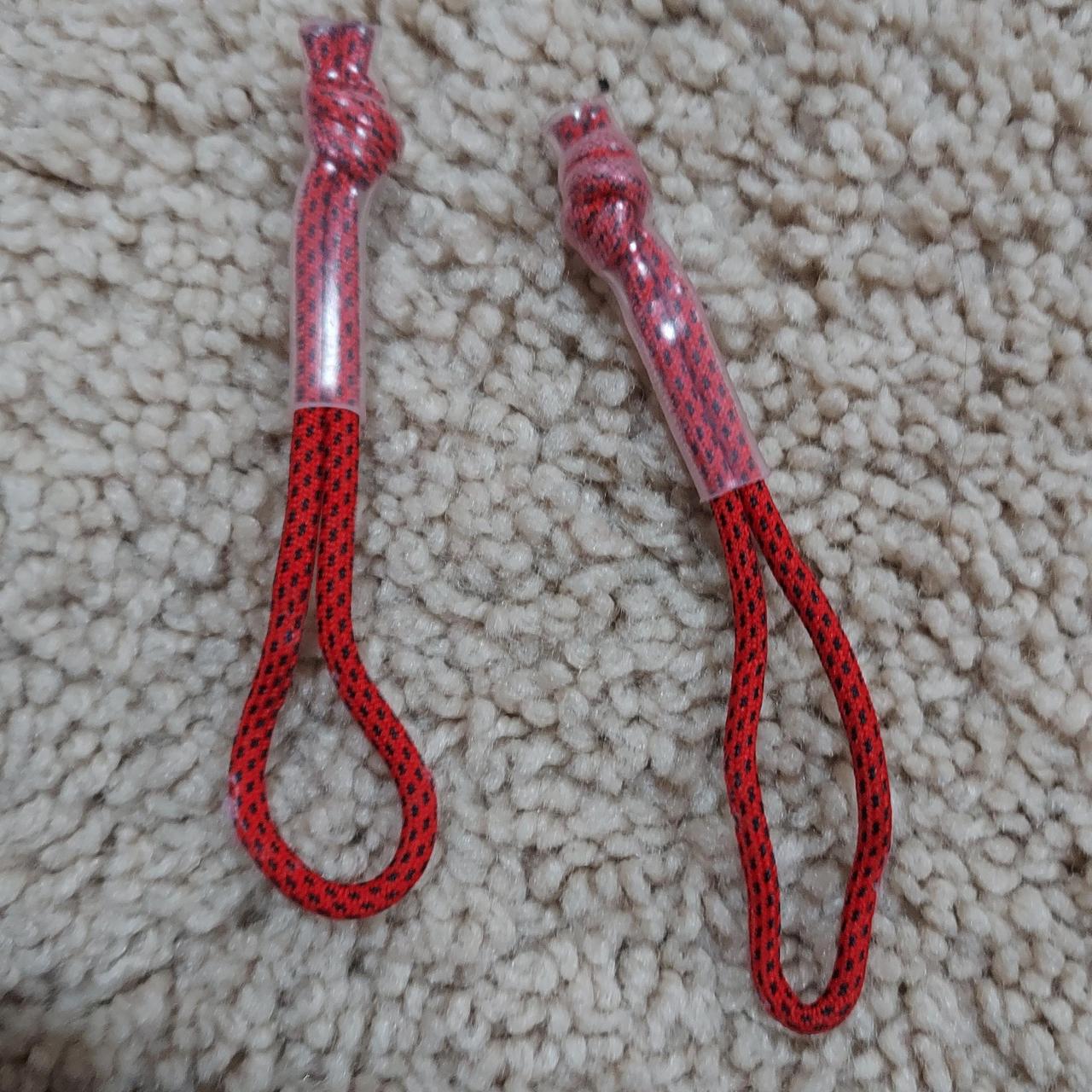 2 red nike elite tags with a sprayground tag - Depop