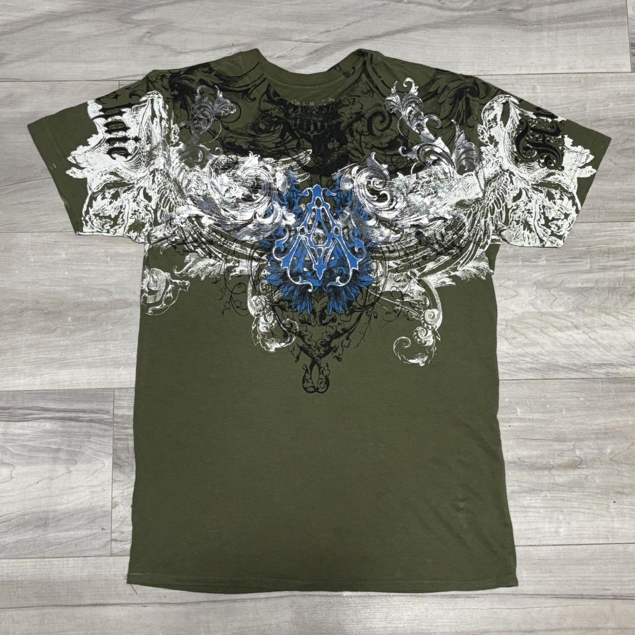 Green and blue archaic brand tee with fire cross... | Depop