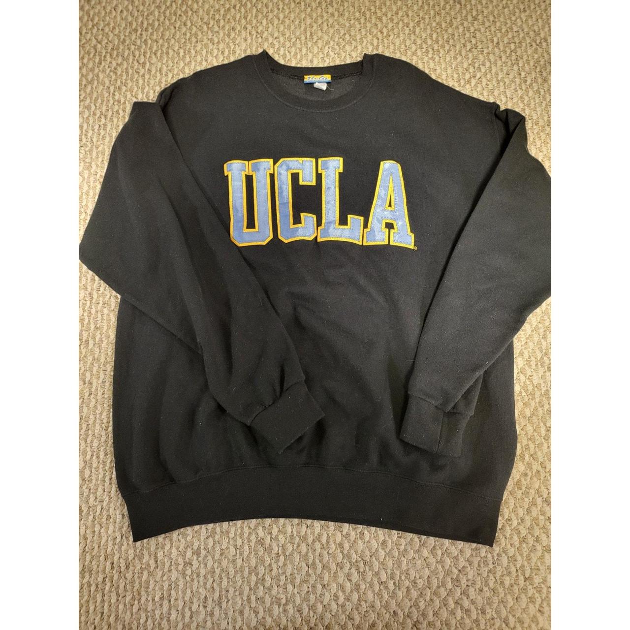 The product is a UCLA crew neck sweatshirt in size... | Depop