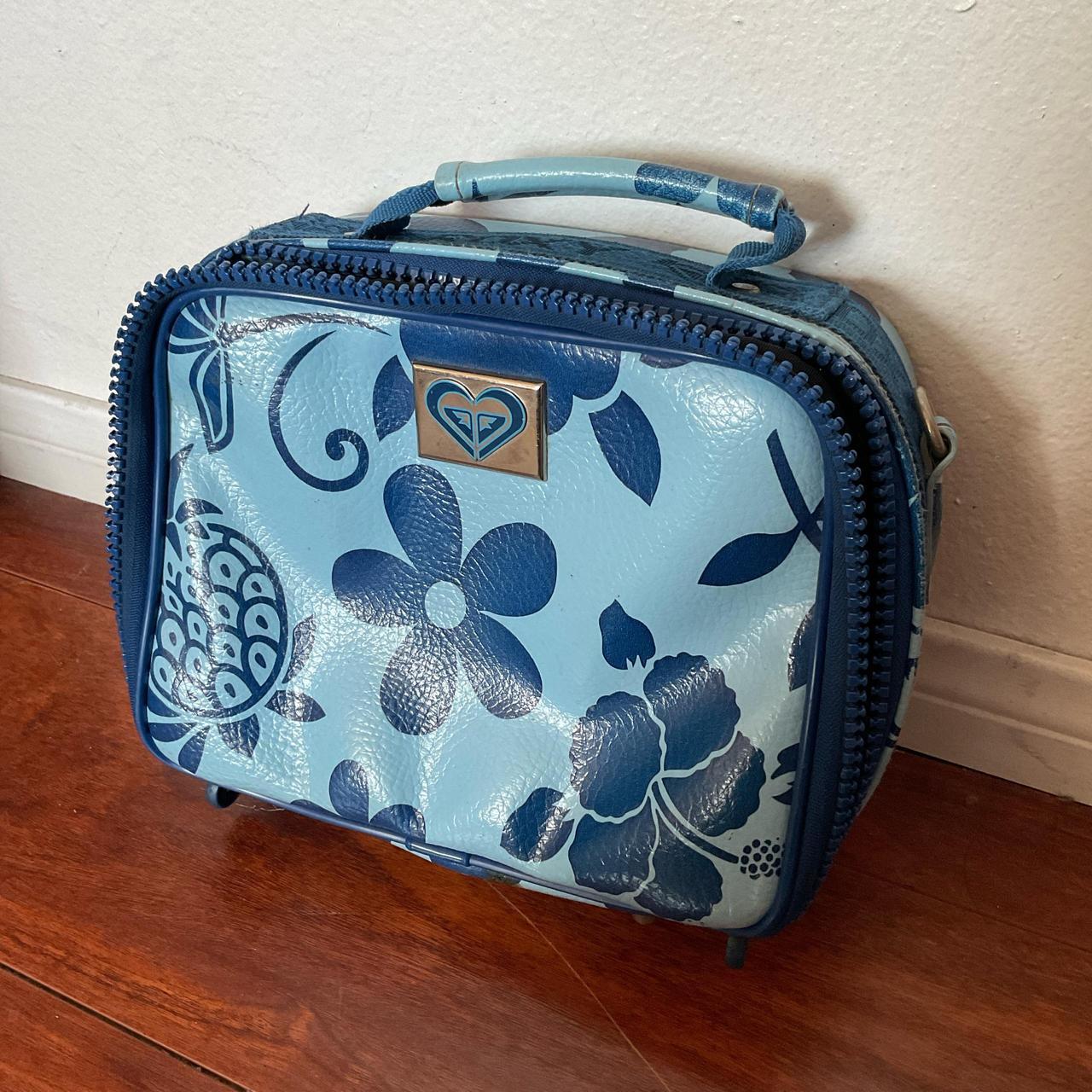 Blue and white Roxy makeup bag with zipper closure... - Depop