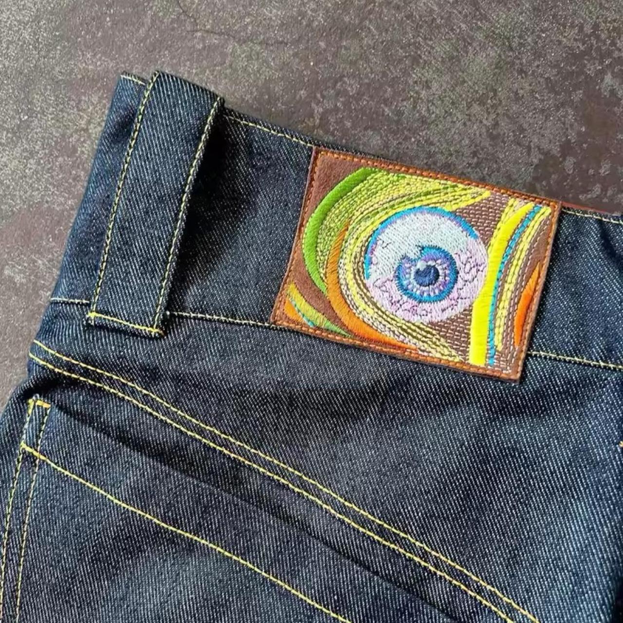 Crazy vintage jeans with eye patch and embroidered... - Depop