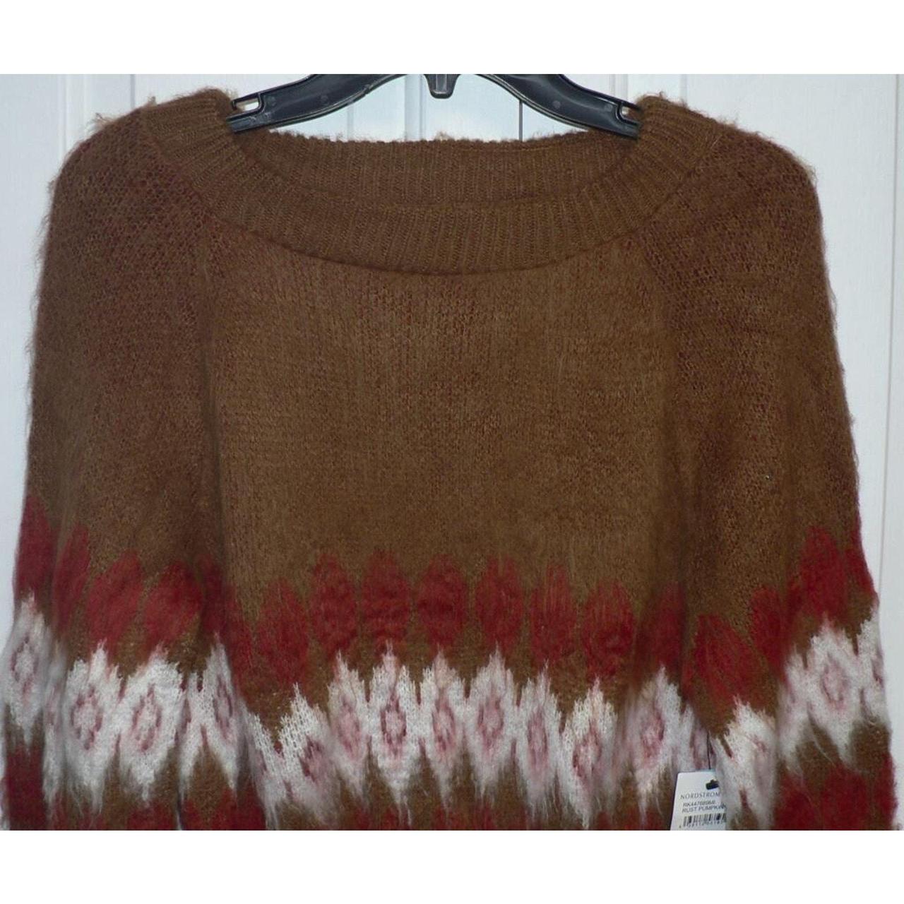 A fuzzy finish elevates this cozy sweater knit in a... | Depop