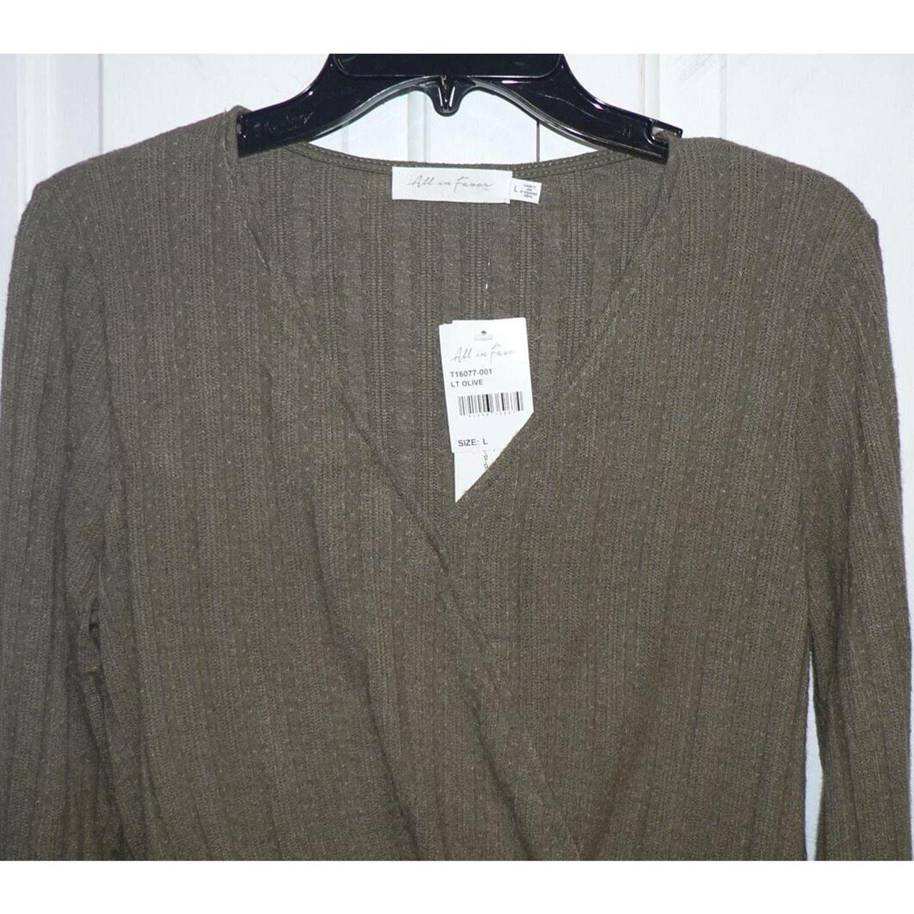 This pointelle knit has an easy faux-wrap design,... | Depop